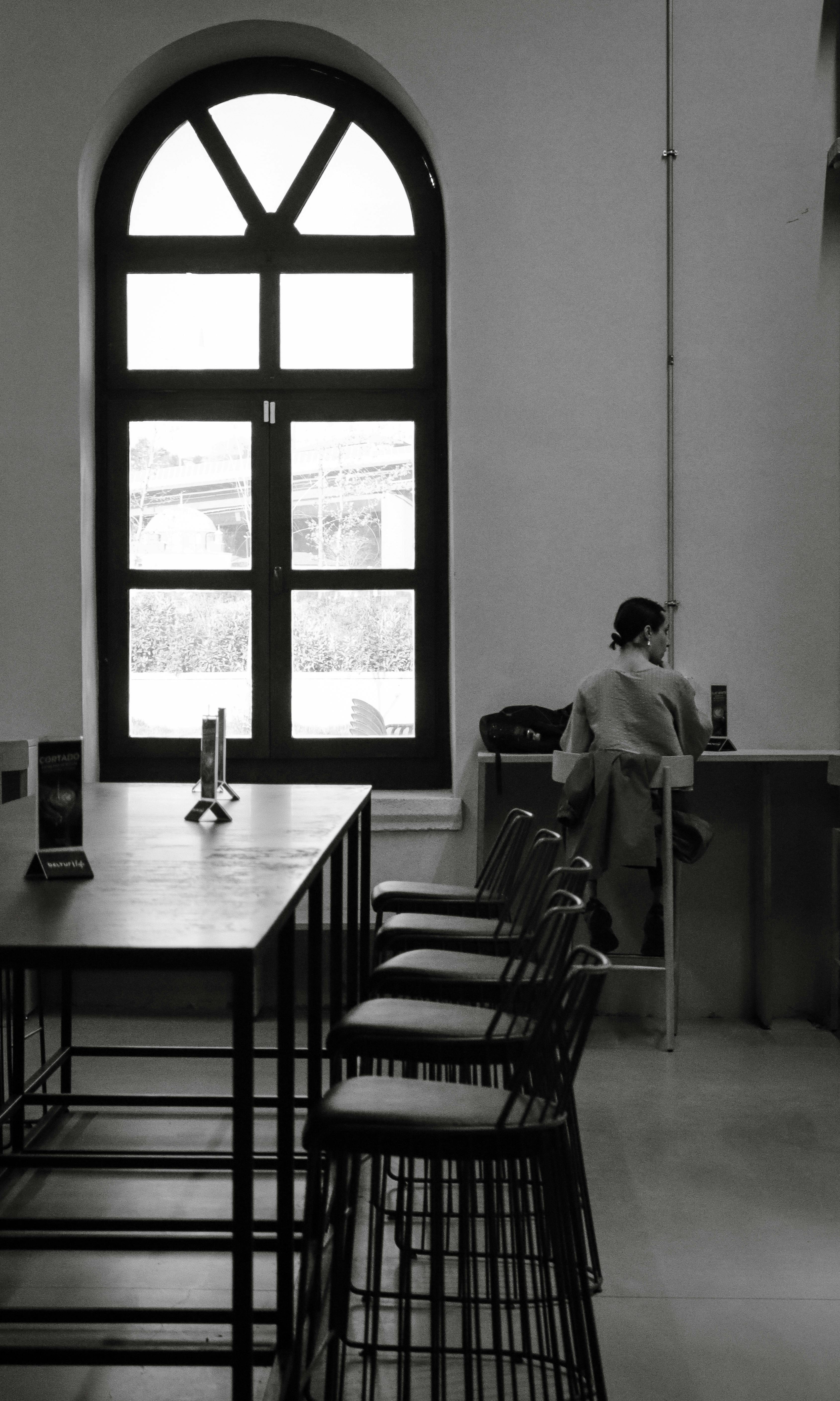 Woman behind Table and Chairs in Room · Free Stock Photo