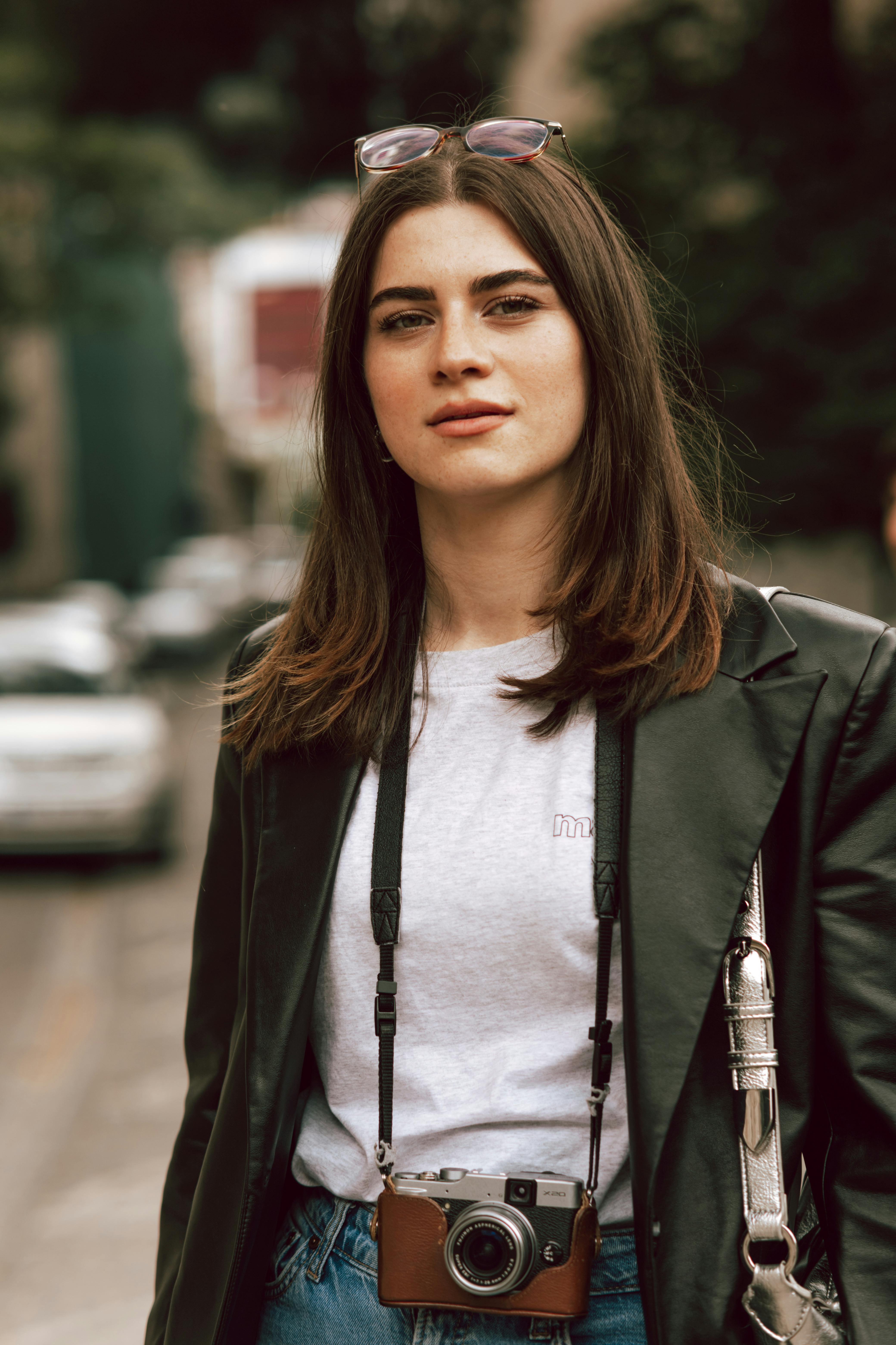 Portrait of woman in Suit Jacket and with Camera · Free Stock Photo