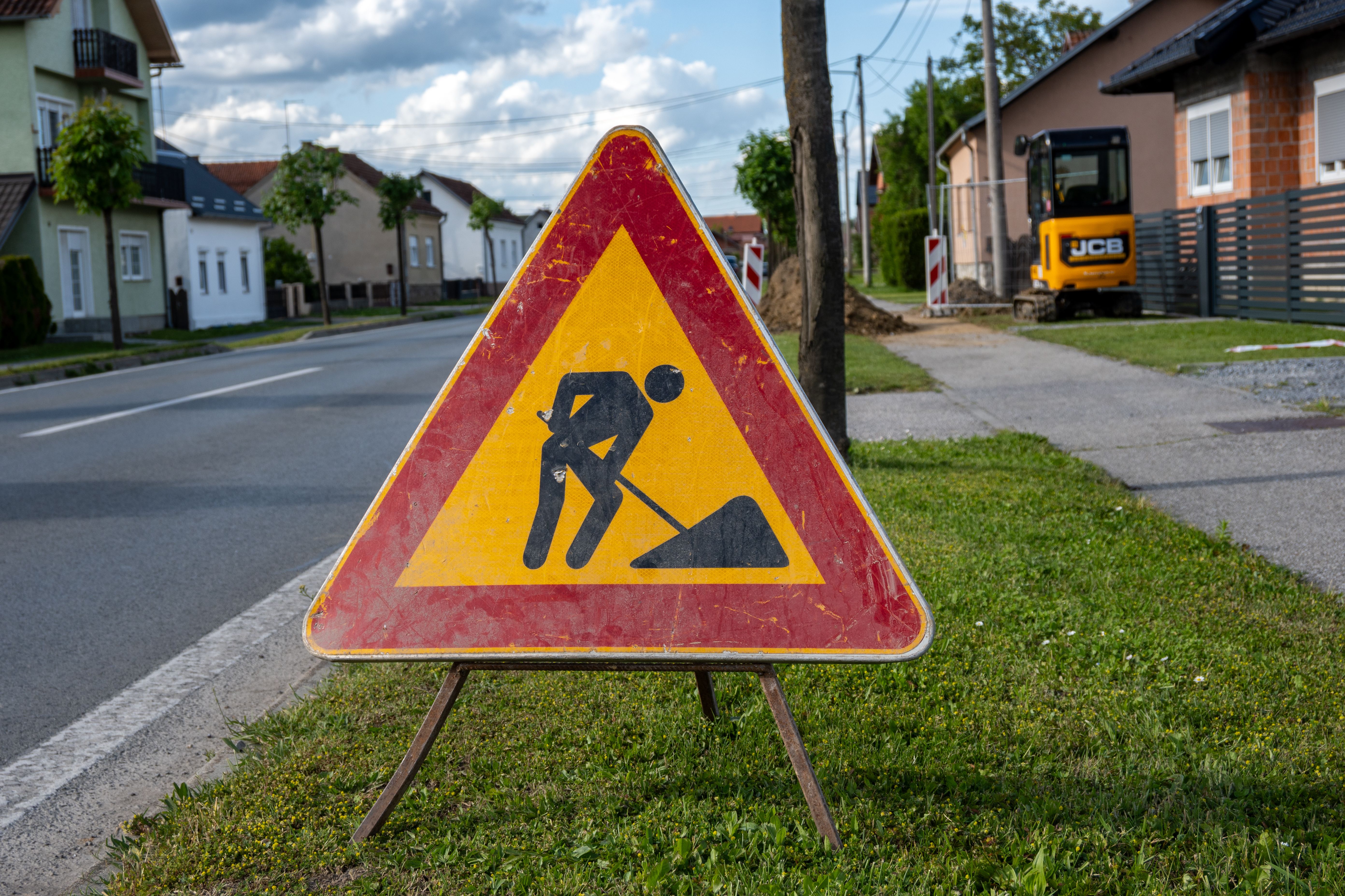 A road sign with a man walking on it · Free Stock Photo