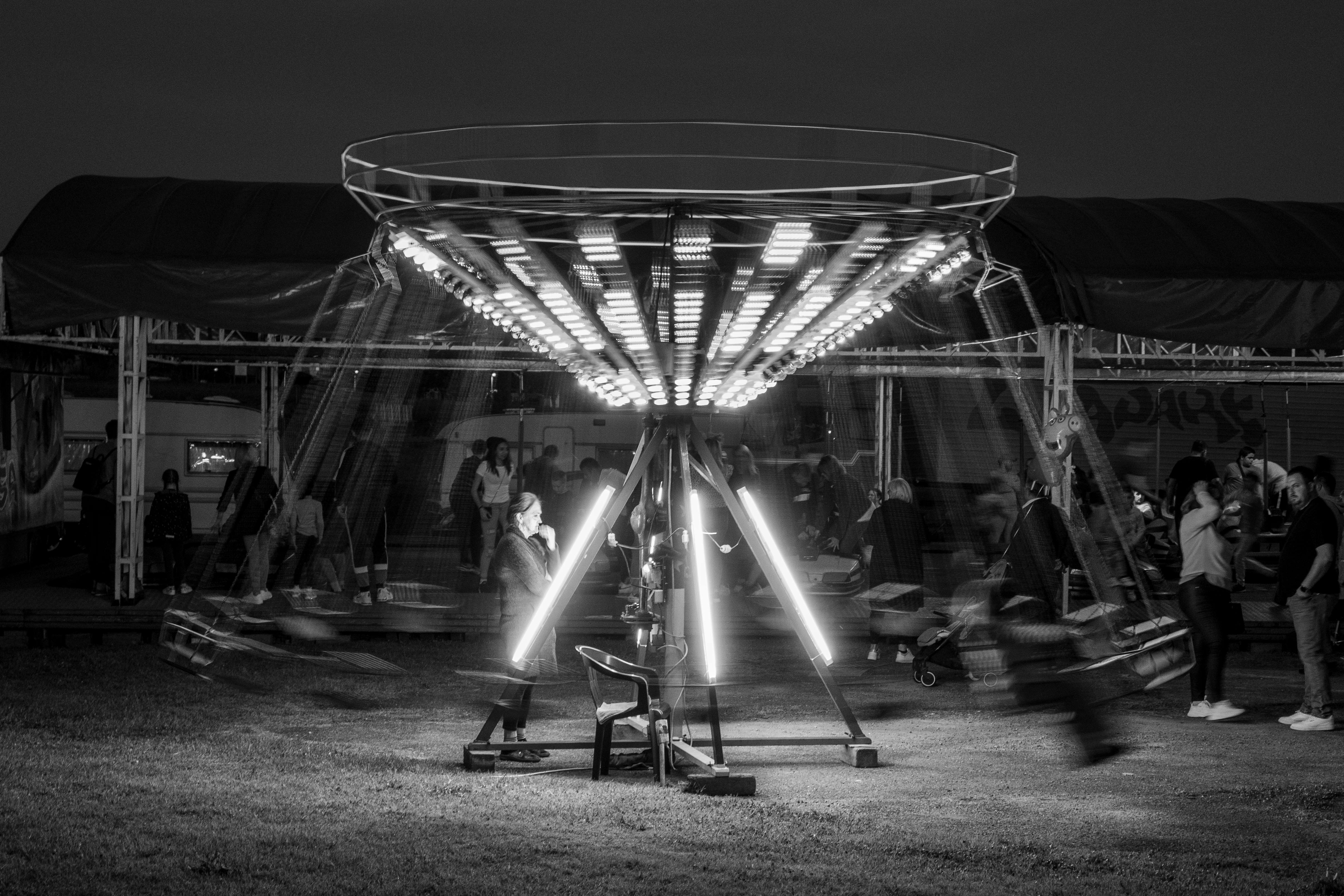 Glowing Swing Ride Spinning at Night · Free Stock Photo