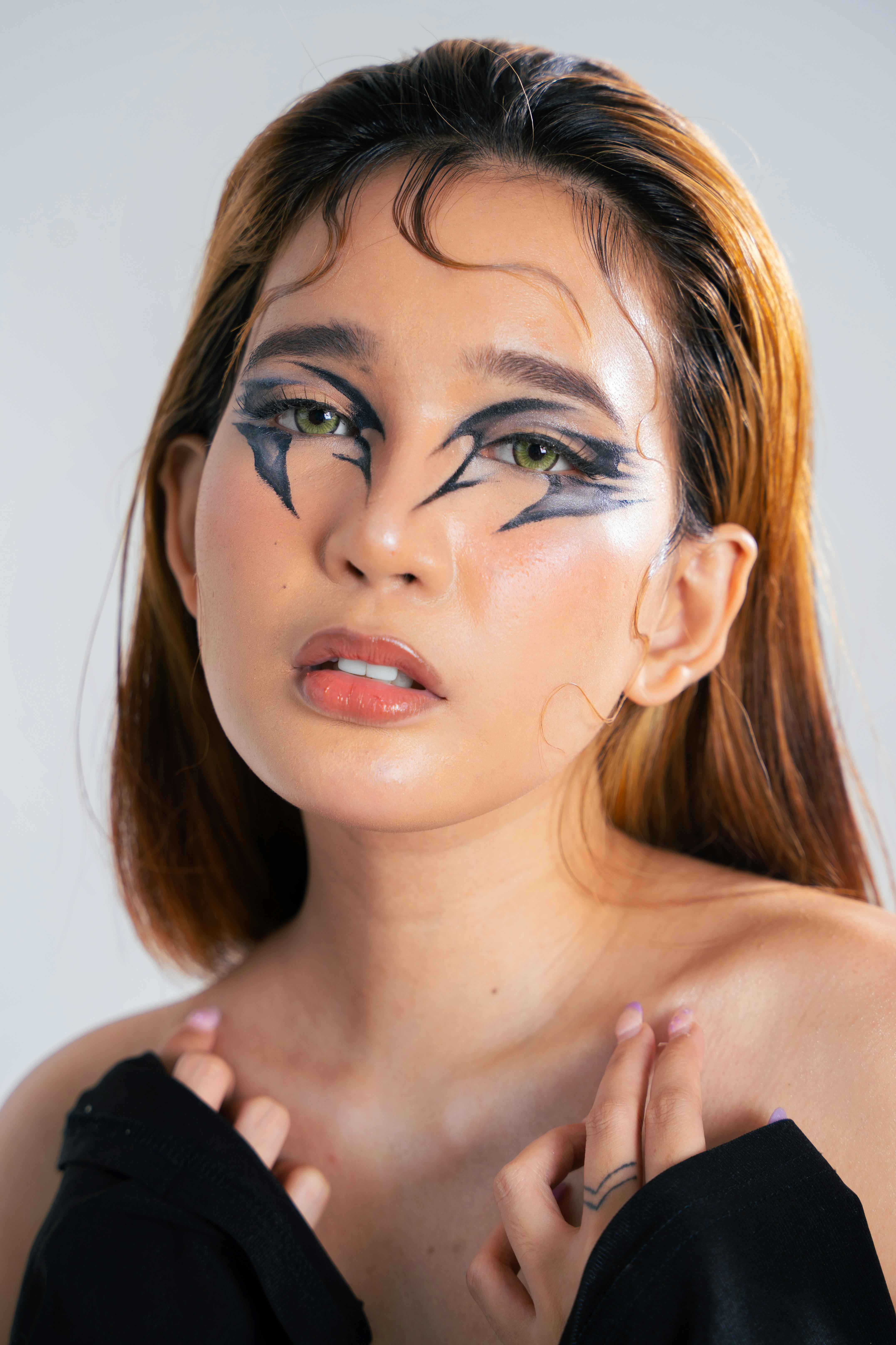 Portrait of a Young Woman with Creative Makeup on her Face · Free Stock ...