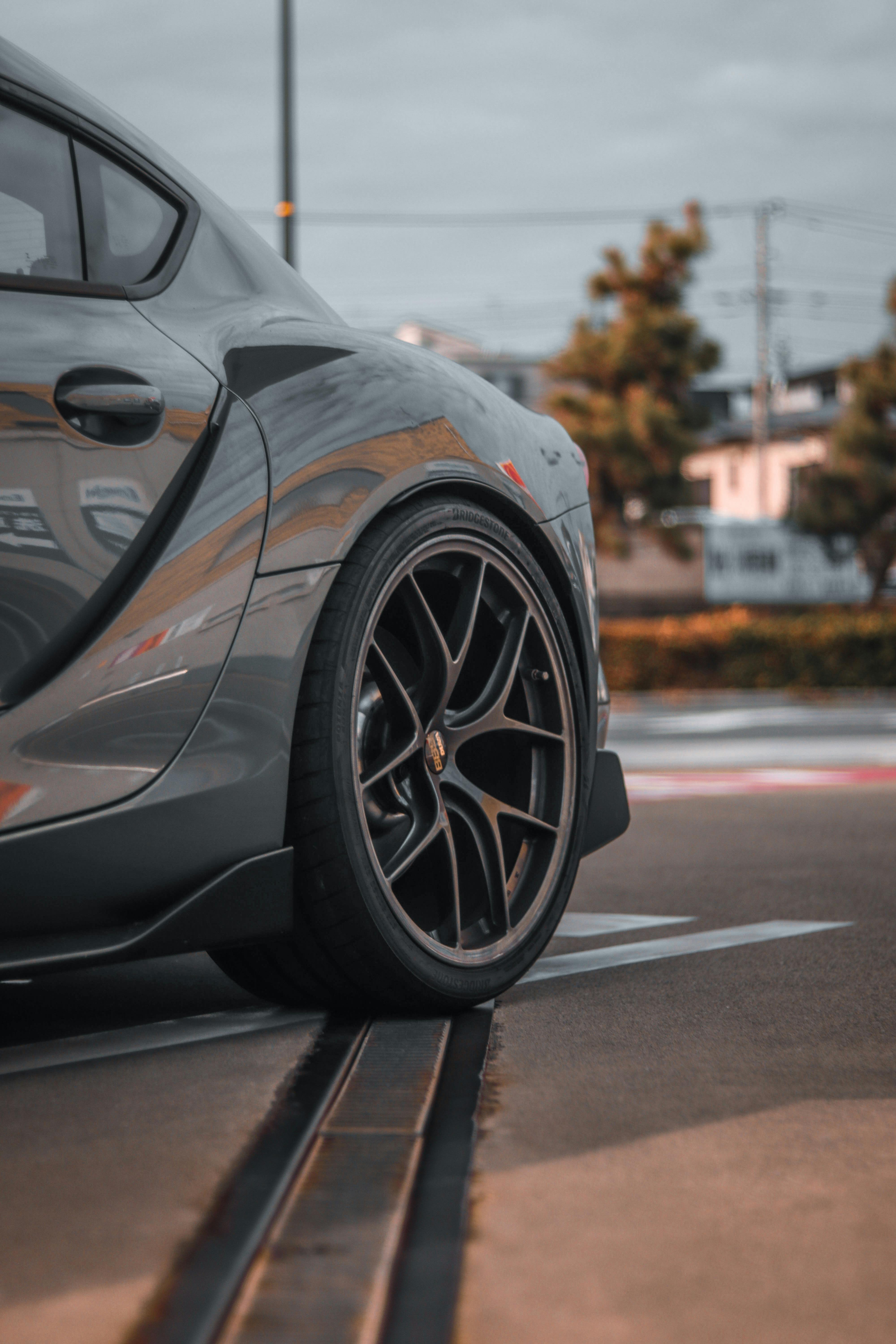 Wheel of Gray Sports Car on Street · Free Stock Photo