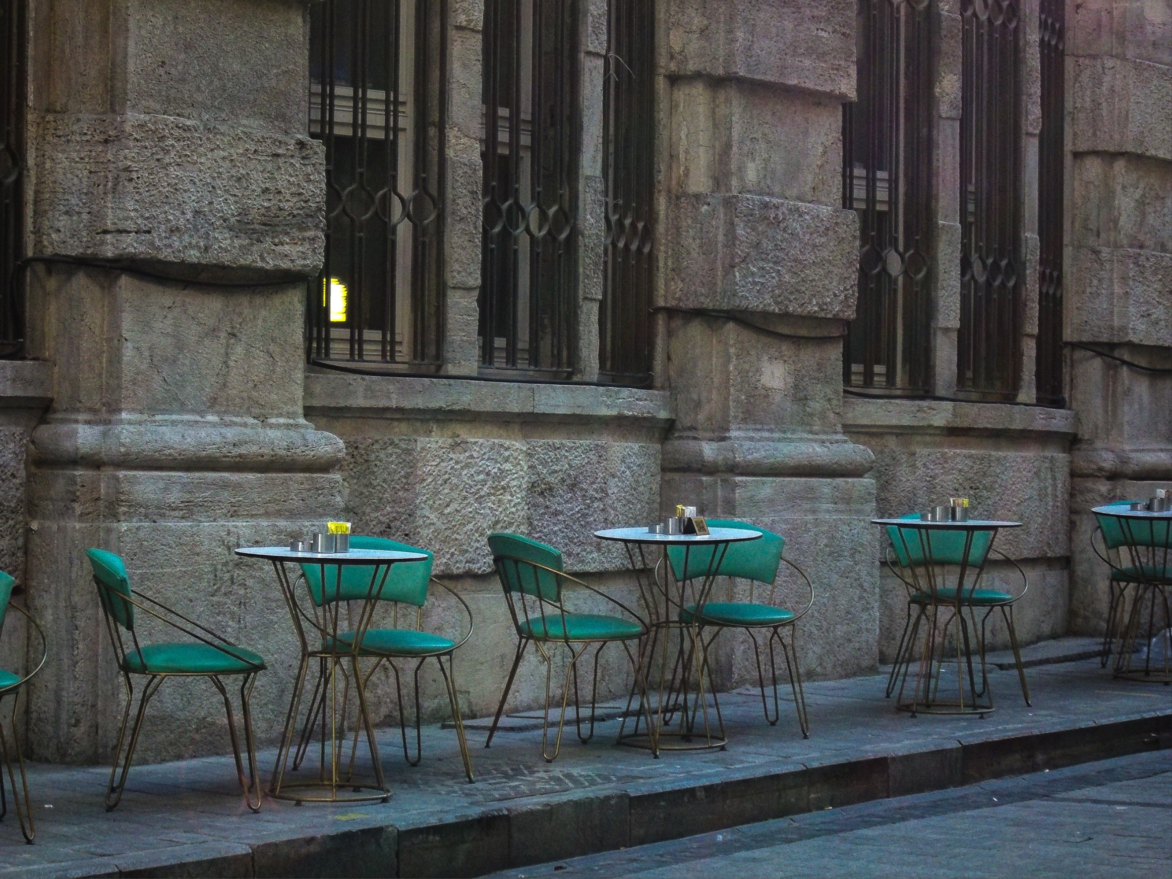 Blue Cafe Tables Standing on Narrow Pavement in front of Old Stone ...