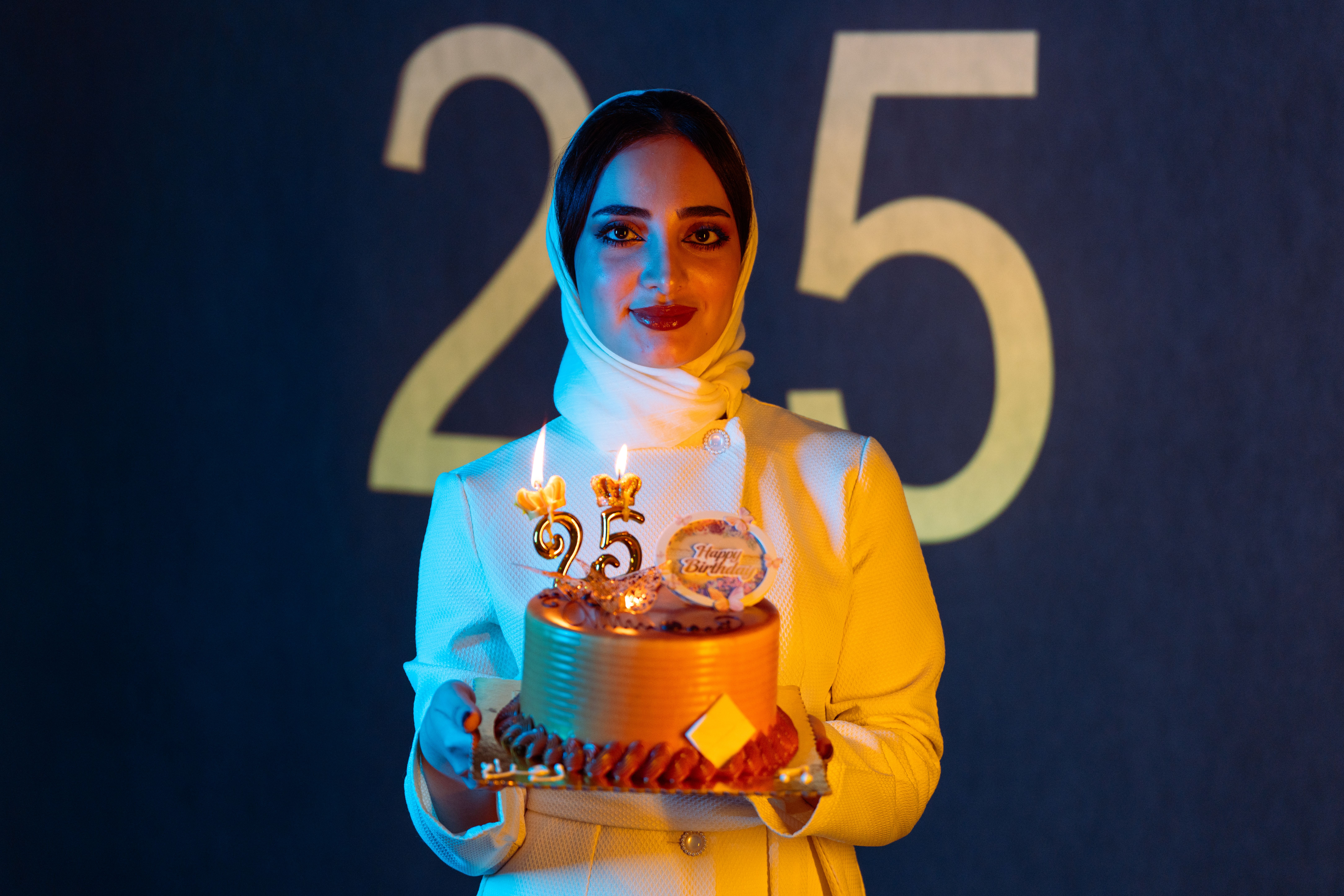 Woman in Formal Jacket and Hijab Holding Birthday Cake with Candles ...