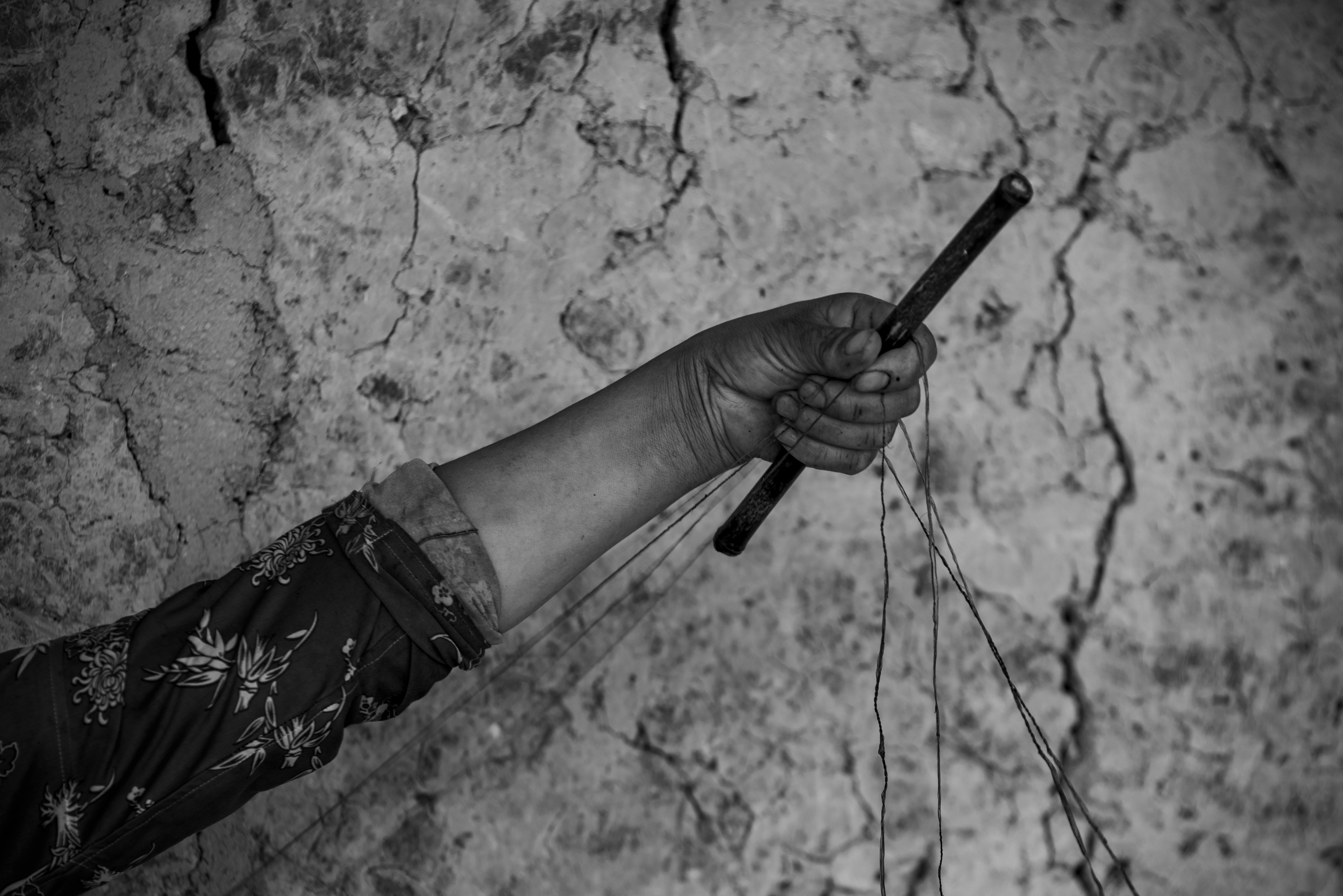 Hand Holding Stick with Strings · Free Stock Photo