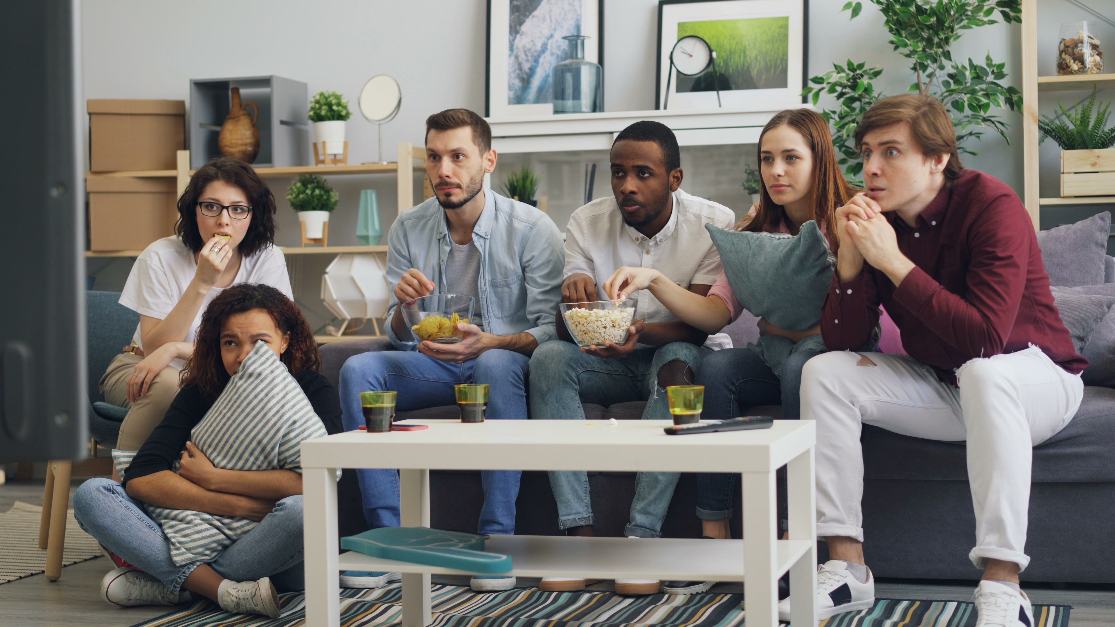Friends Sitting on Couch and Watching Movie · Free Stock Photo