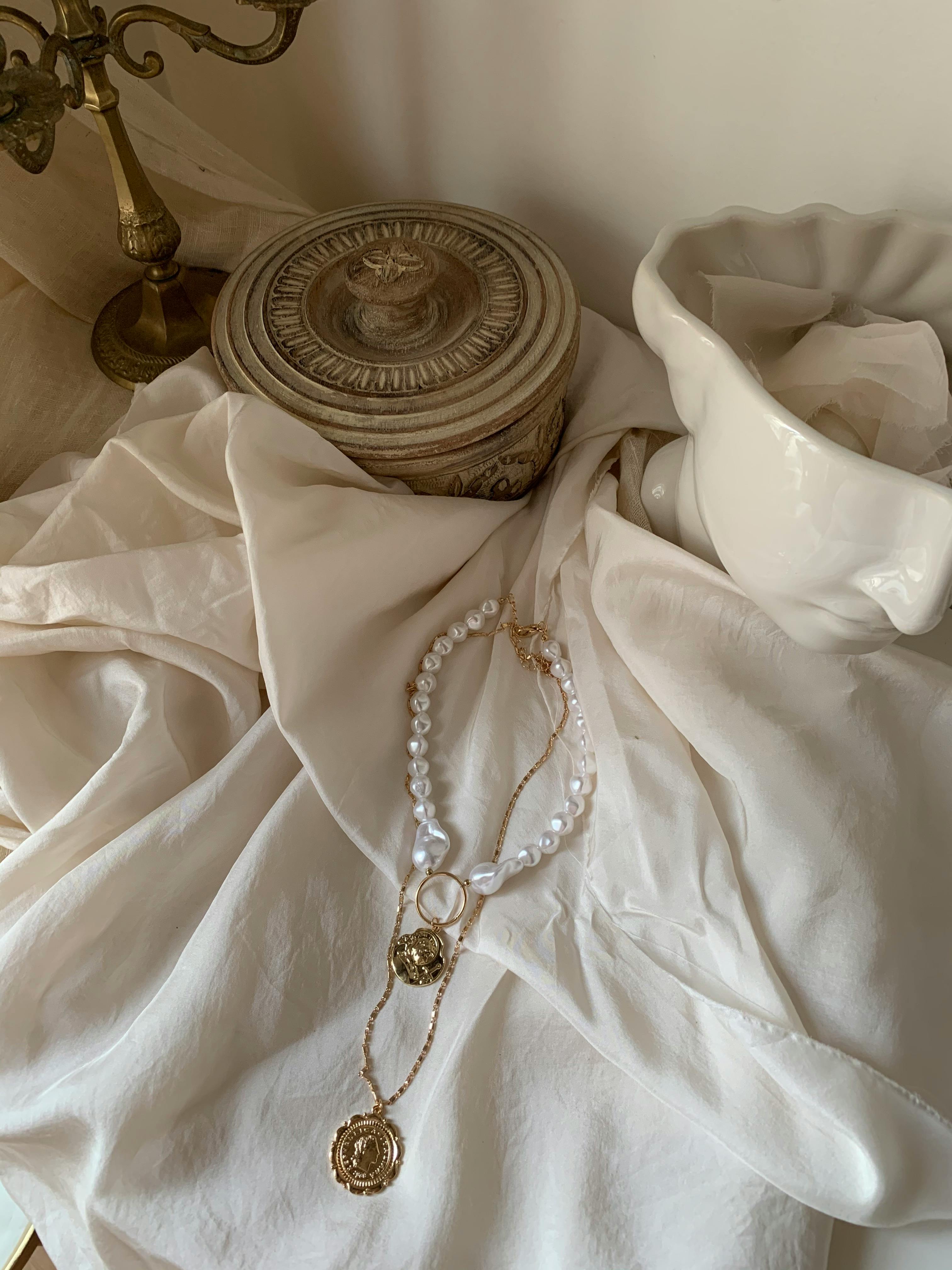 Jewelry on Table and in Shell · Free Stock Photo