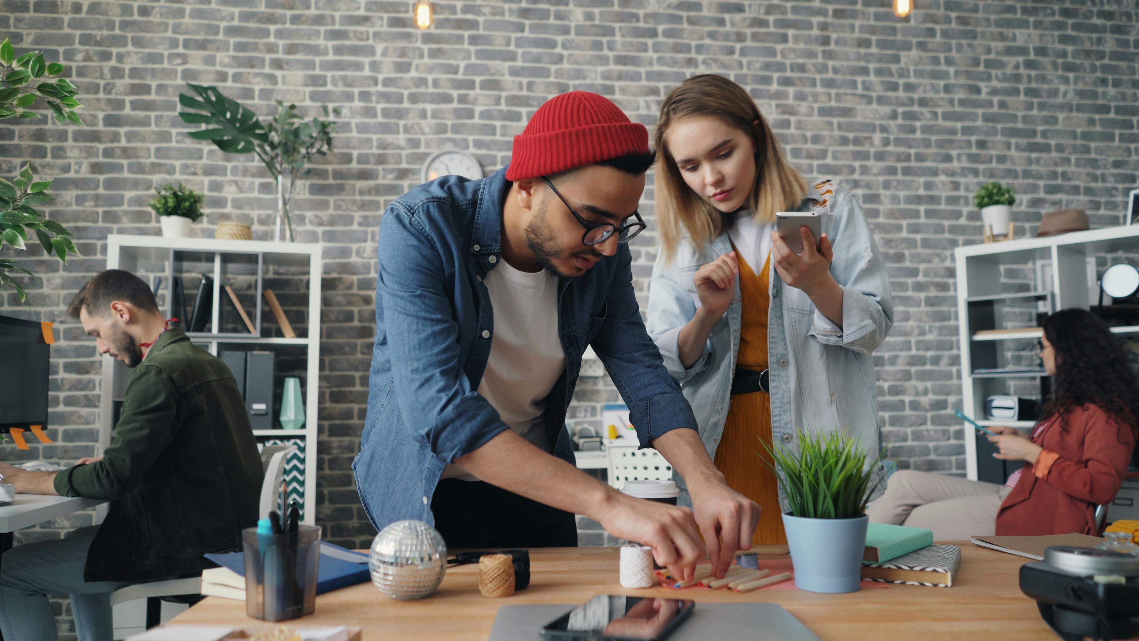 Office Workers Preparing Decoration on a Table for the Photo · Free ...