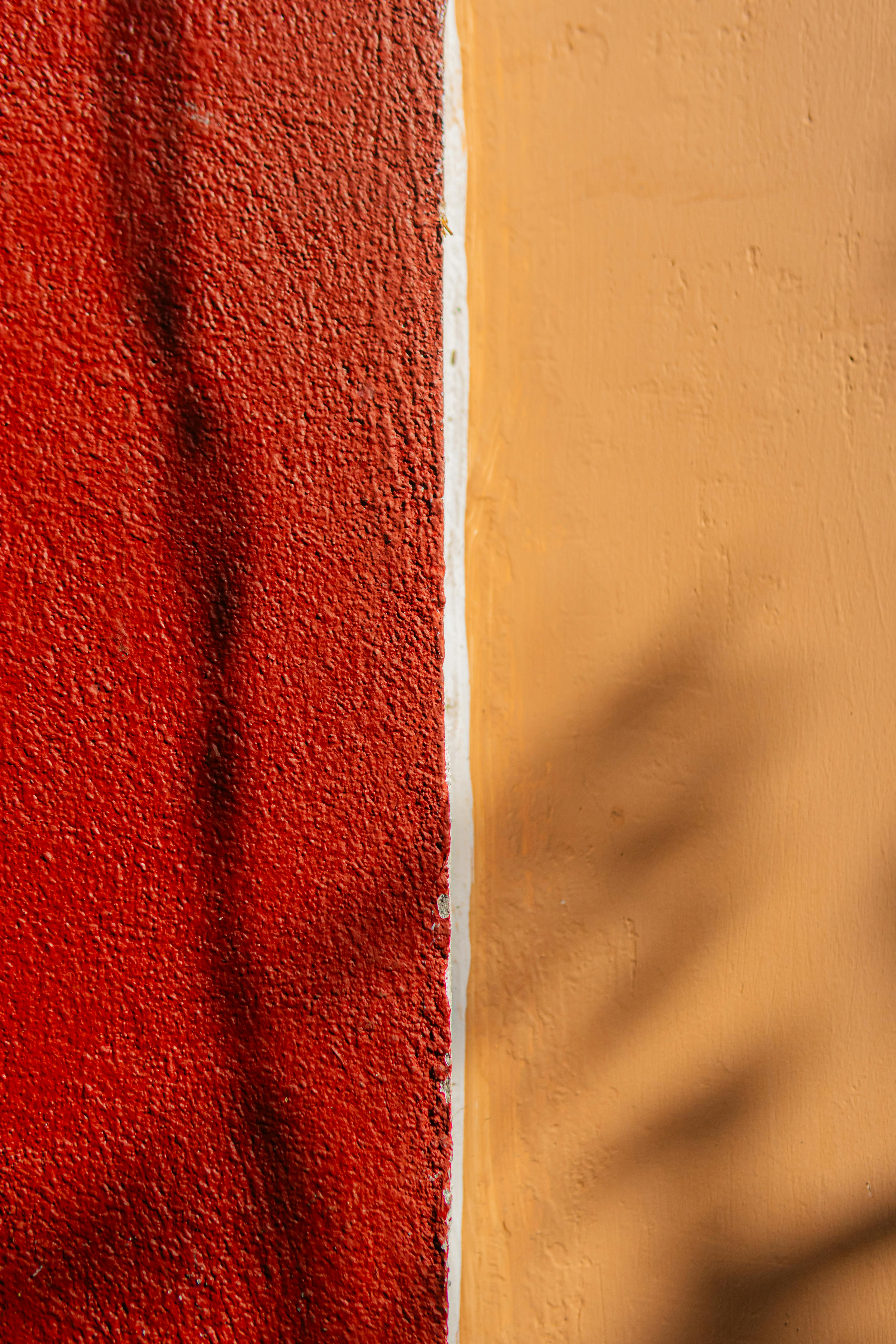 Split of Yellow and Red Paint on Wall · Free Stock Photo