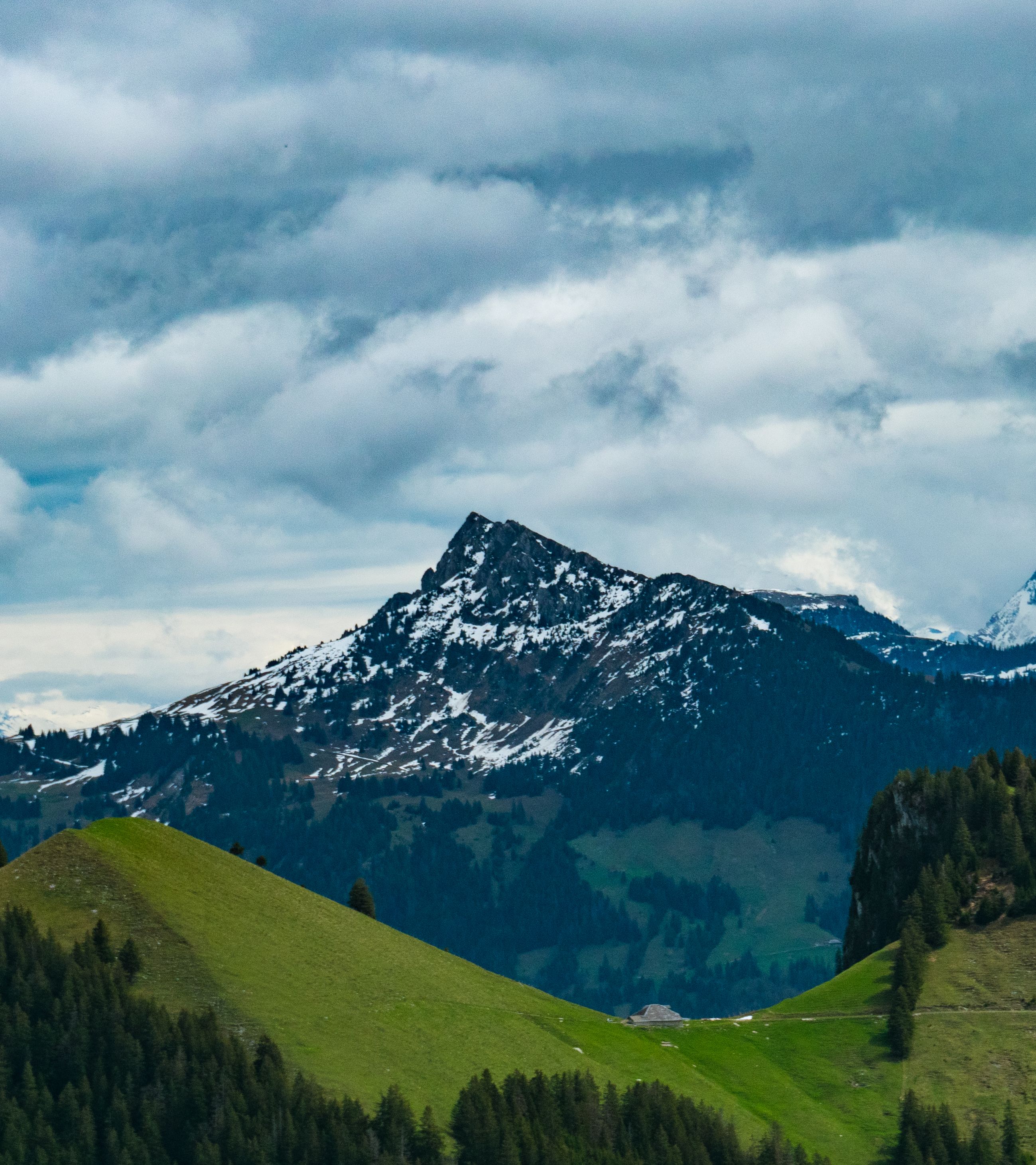 Vertical Shot of a Snow Covered Mountain Peak · Free Stock Photo