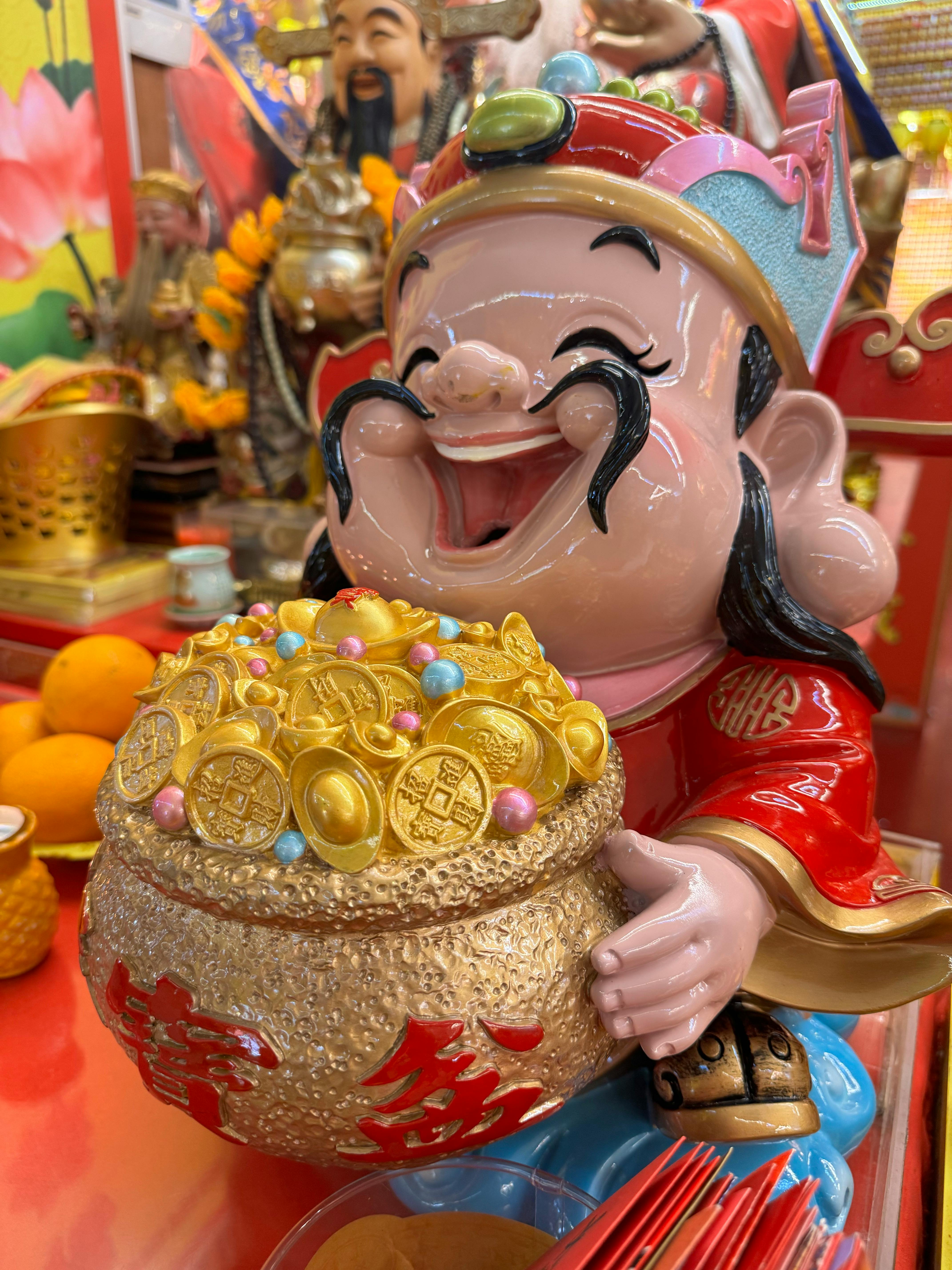 Figurine of a Clown with a Pot of Gold Coins · Free Stock Photo