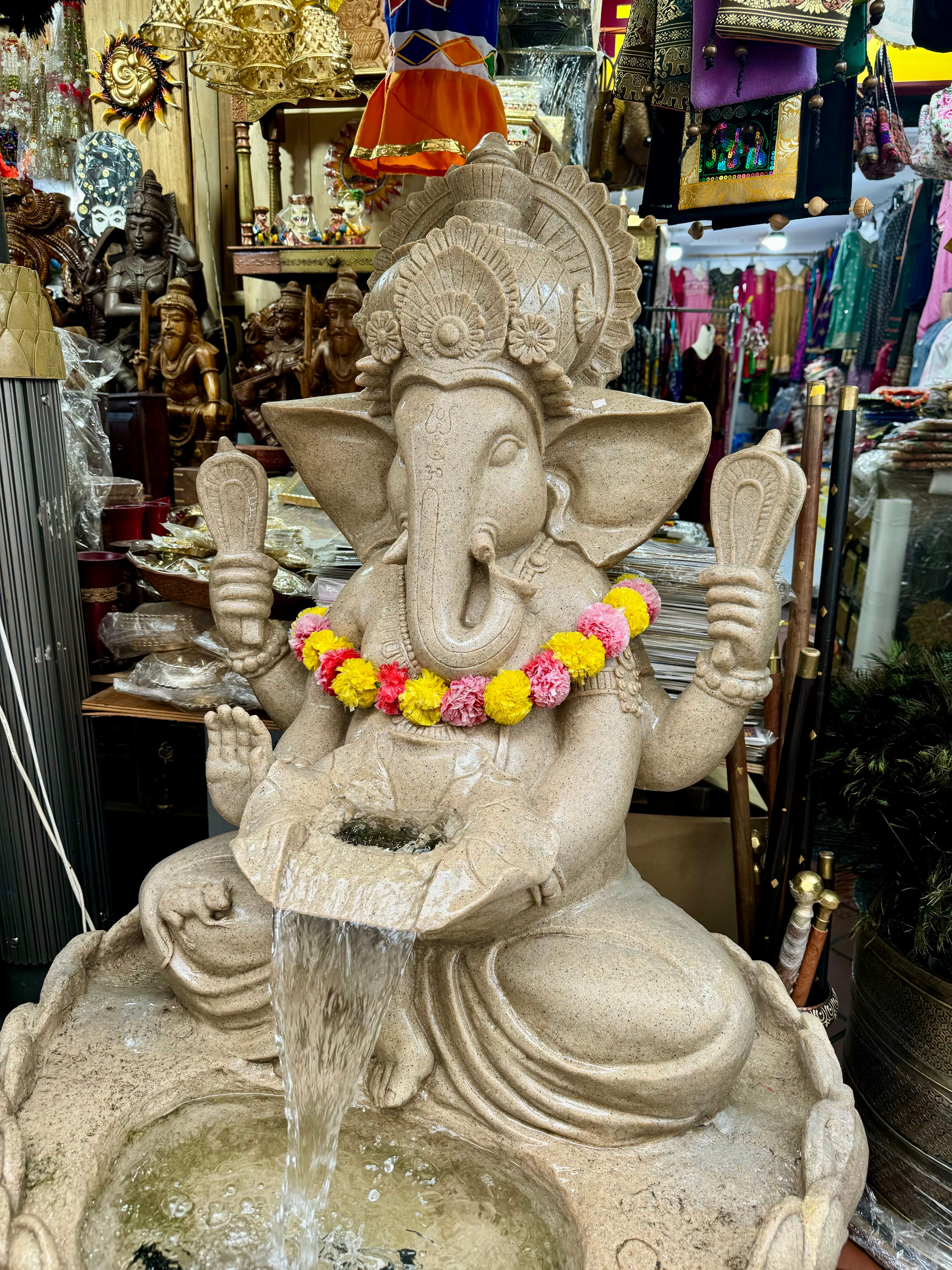 Orange Garland on a Hindu God Statue · Free Stock Photo