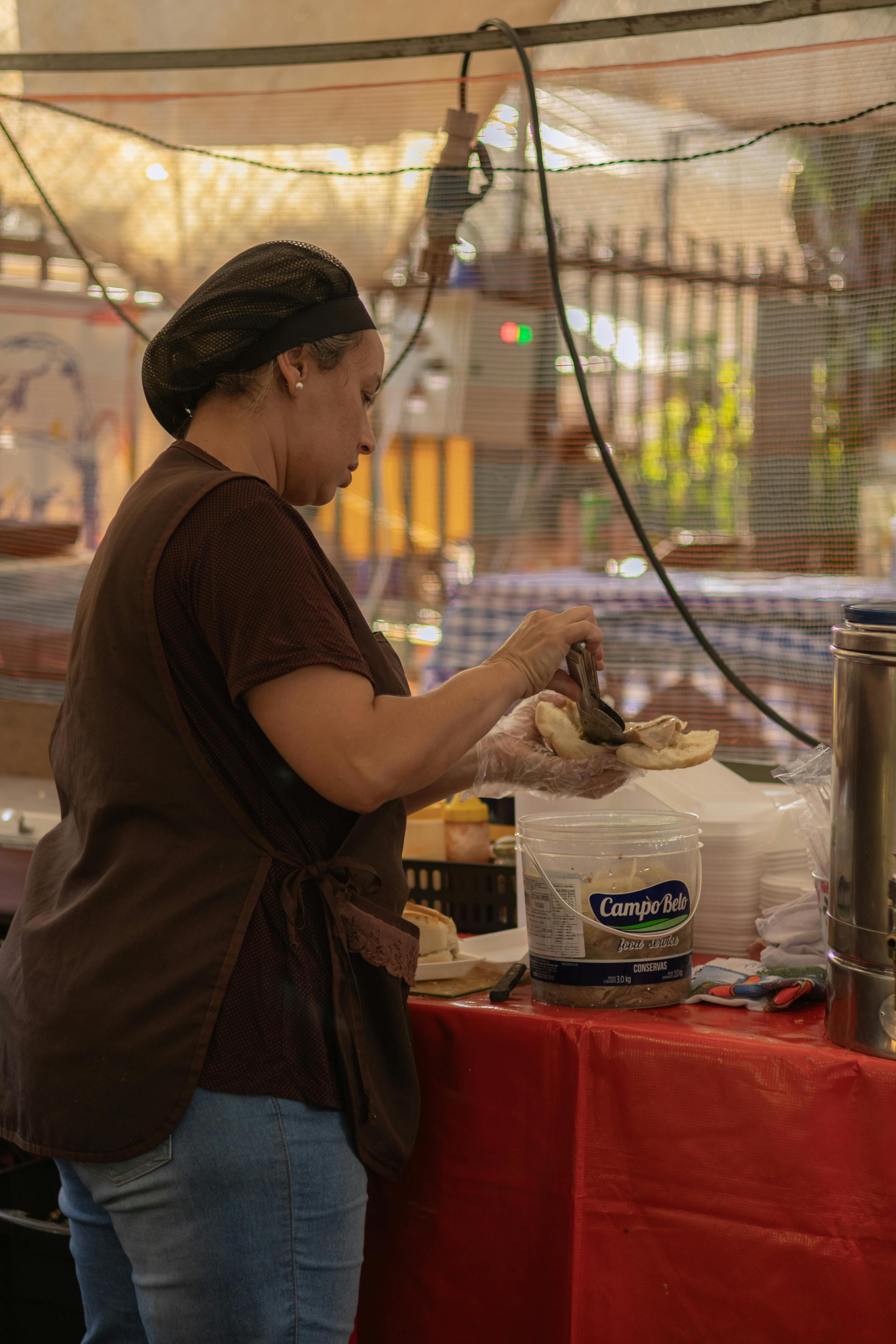 Woman Working at a Concession Stand · Free Stock Photo