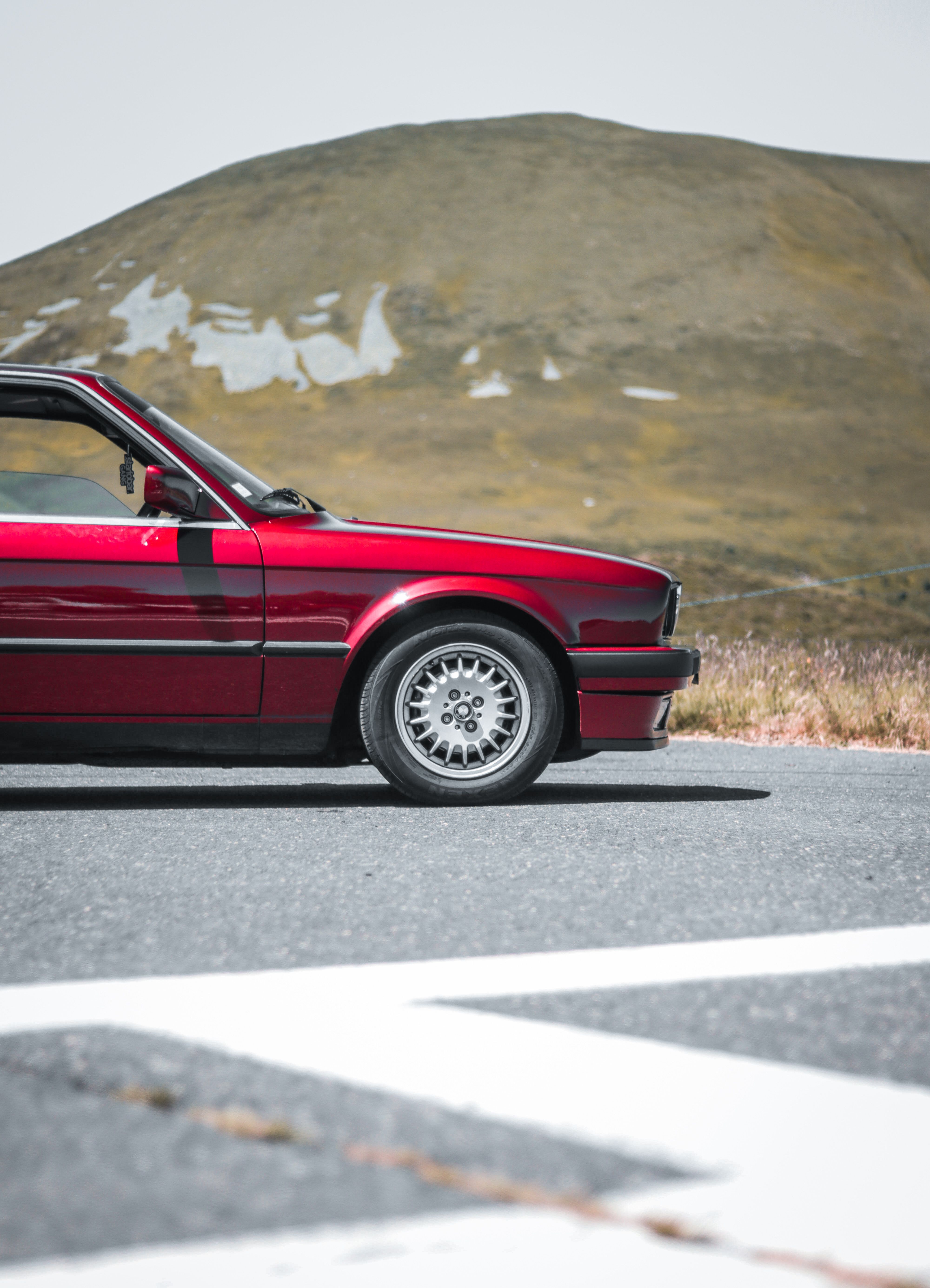 Red Classic BMW E30 on a Parking Lot in the Mountains · Free Stock Photo