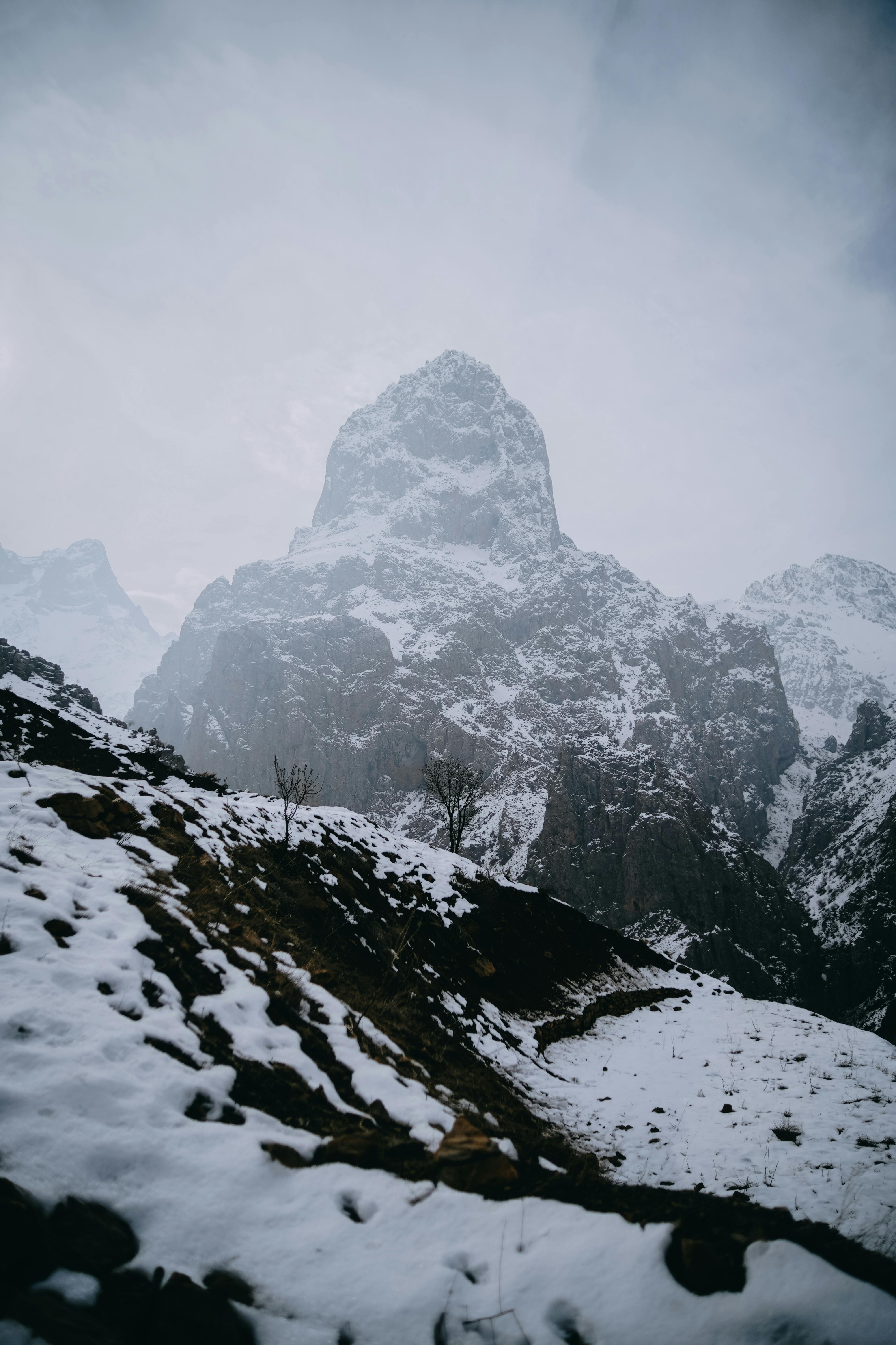 Fog Over Snow Covered Mountains · Free Stock Photo