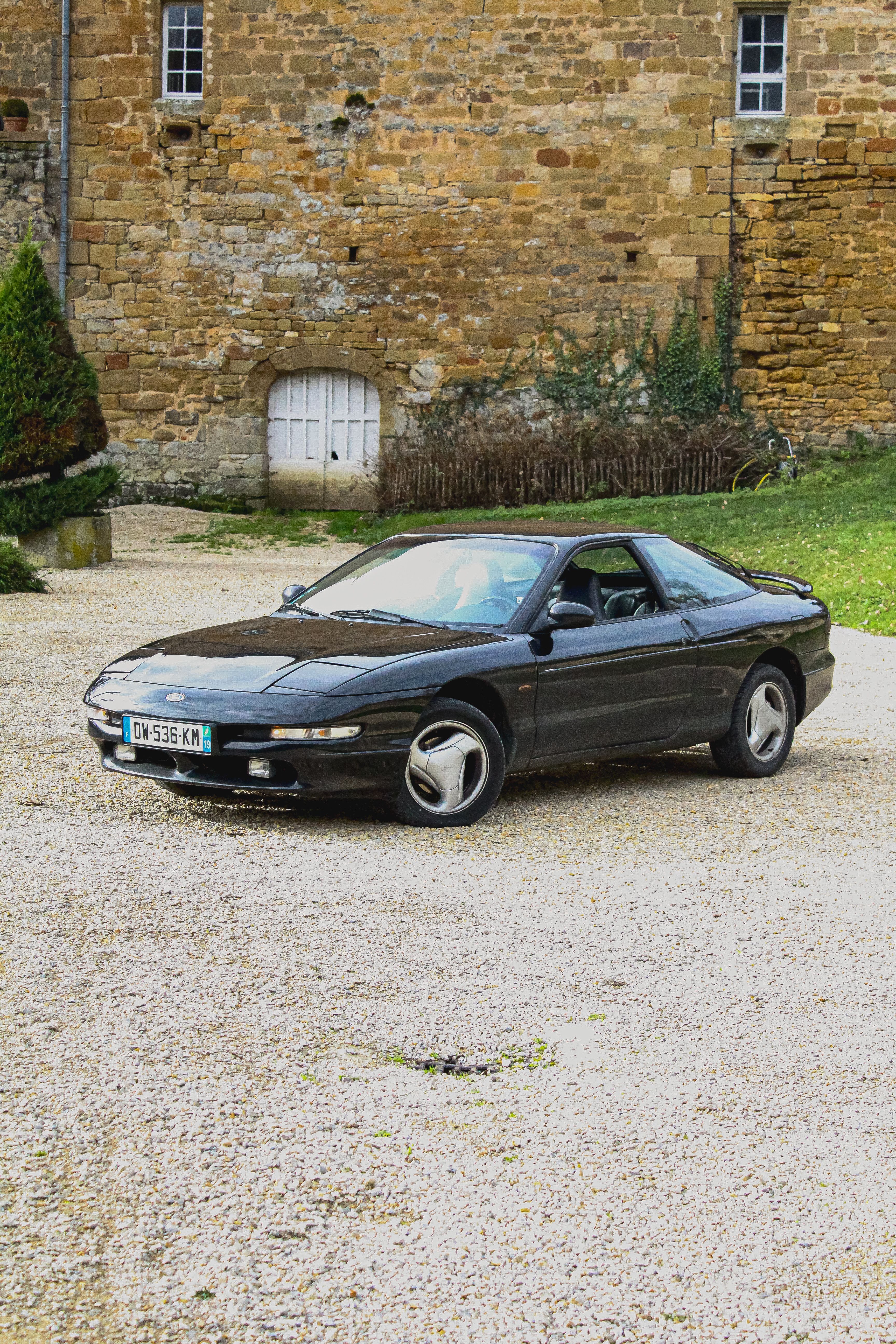 Black Classic Ford Probe in the Driveway · Free Stock Photo
