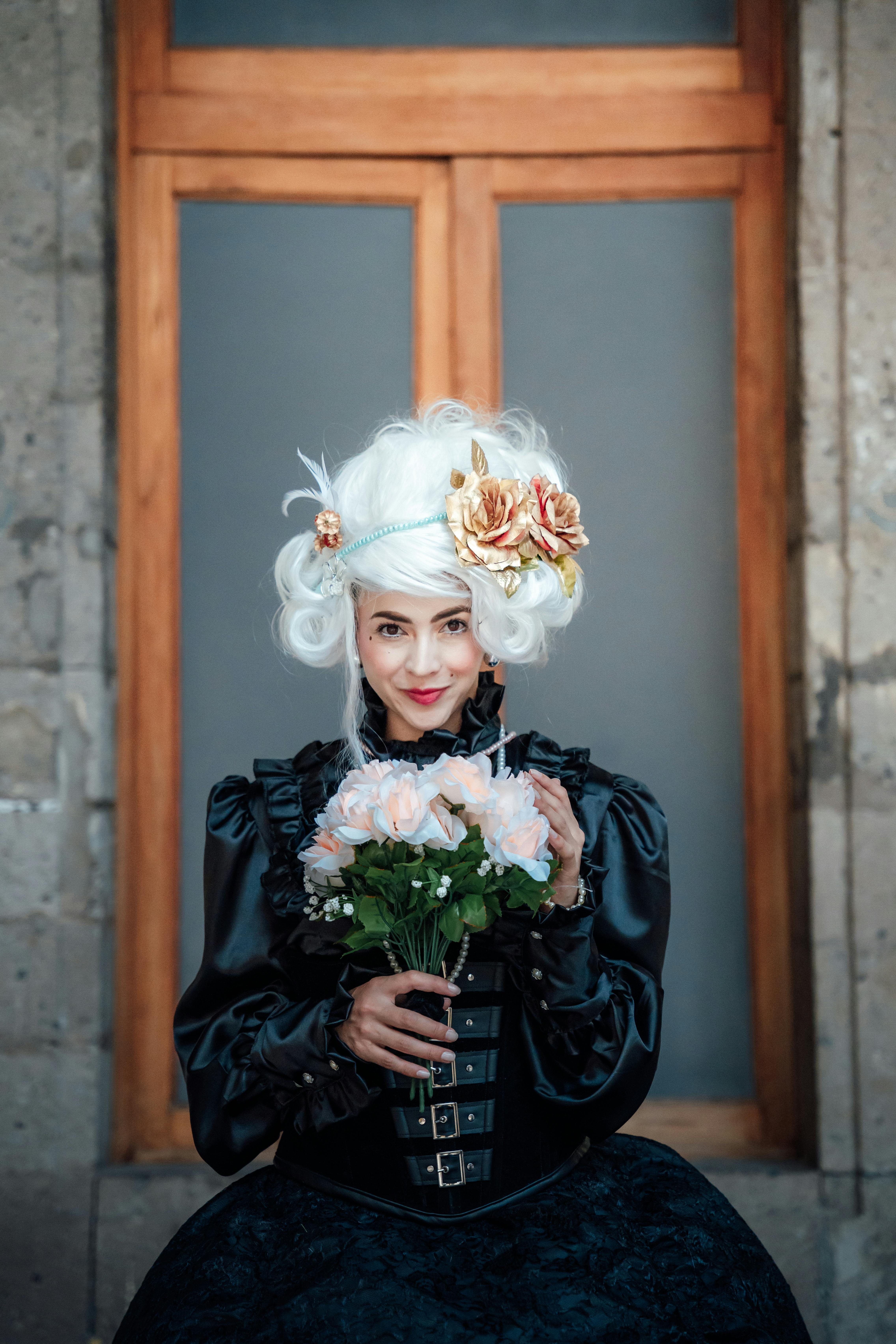 Portrait of Woman in Wig, Dress and with Flowers Bouquet · Free Stock Photo