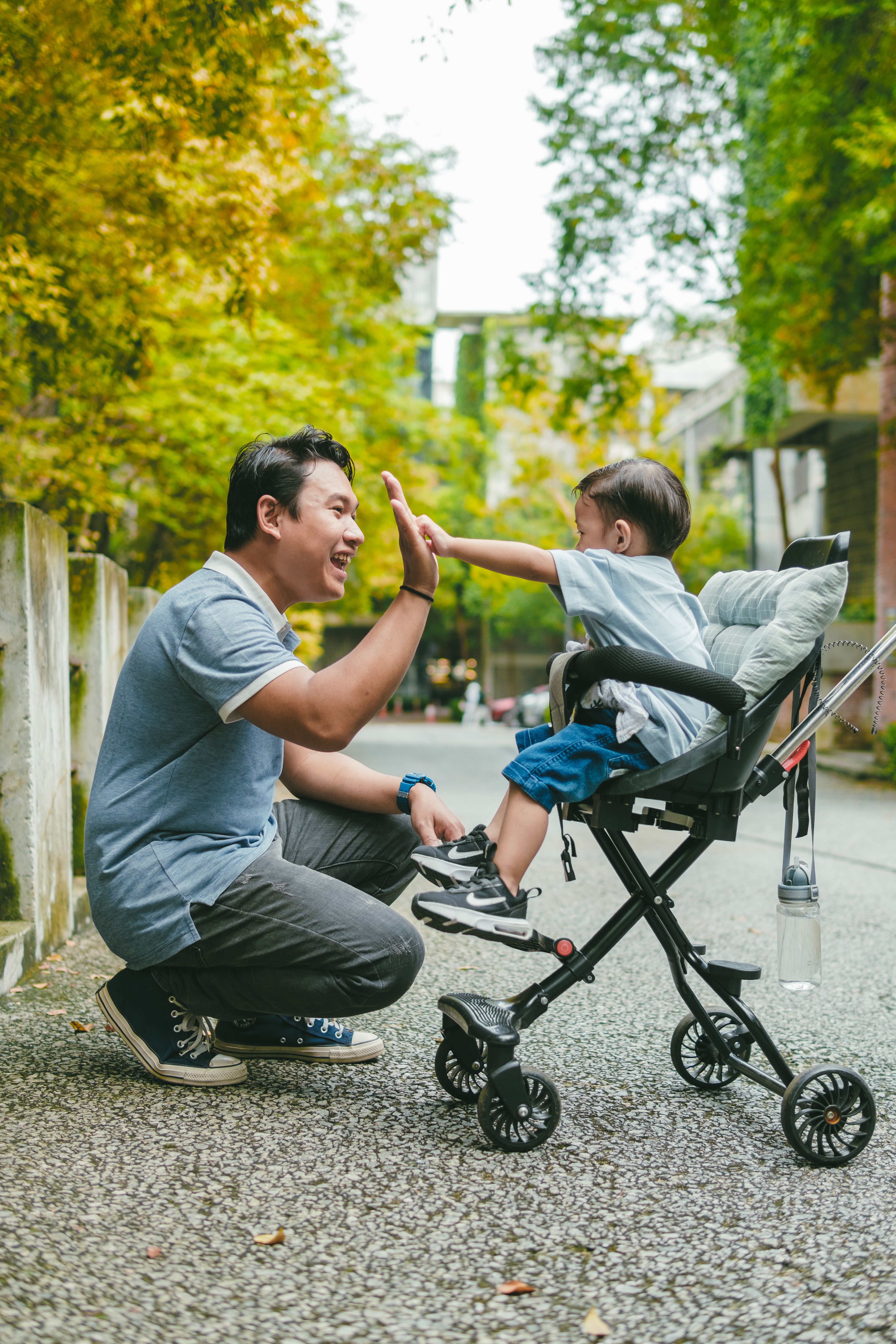 Photo of Man Pushing Baby on Stroller on Permeable Pavement · Free ...