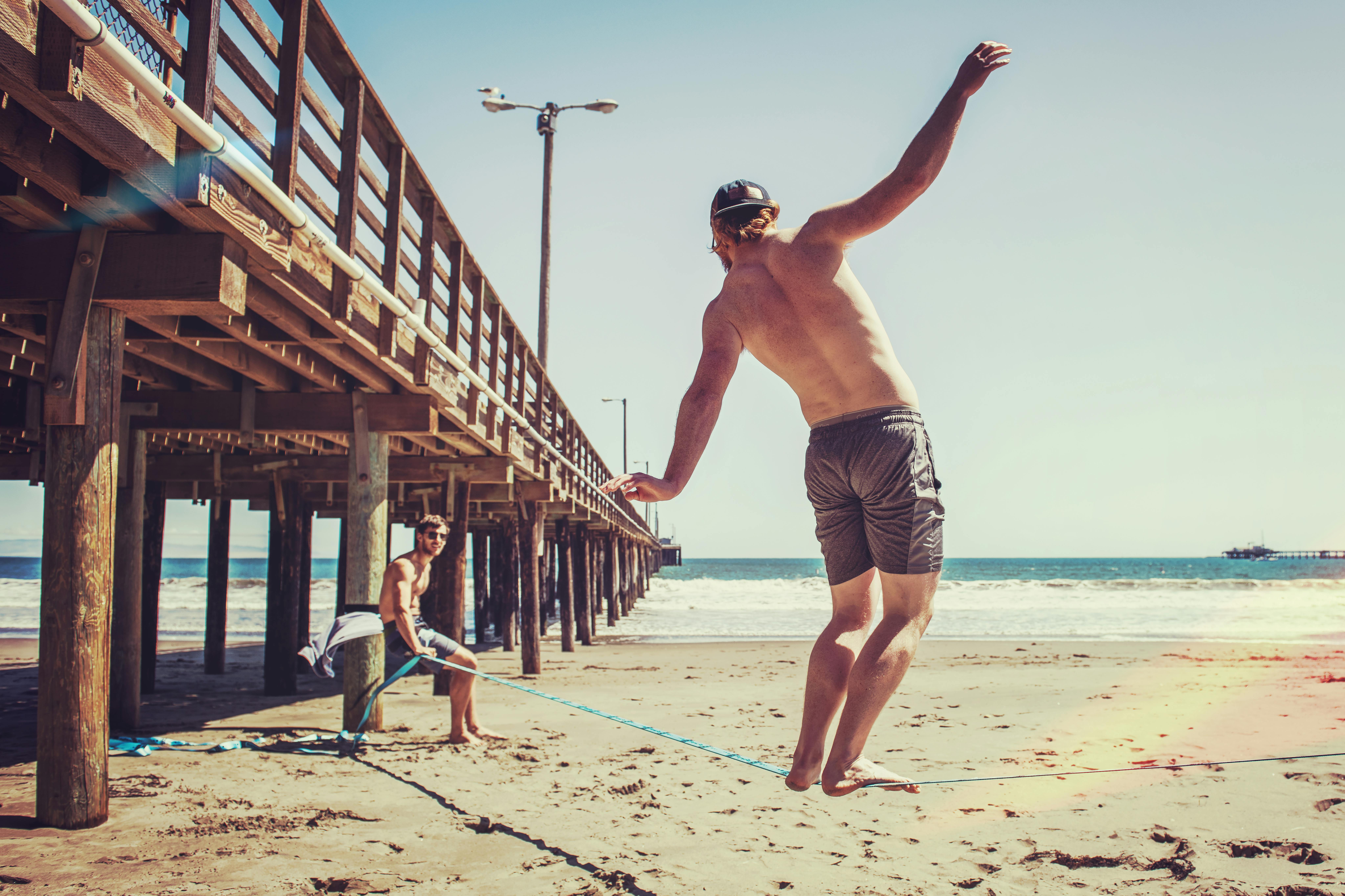 Person Balancing On Blue Rope · Free Stock Photo
