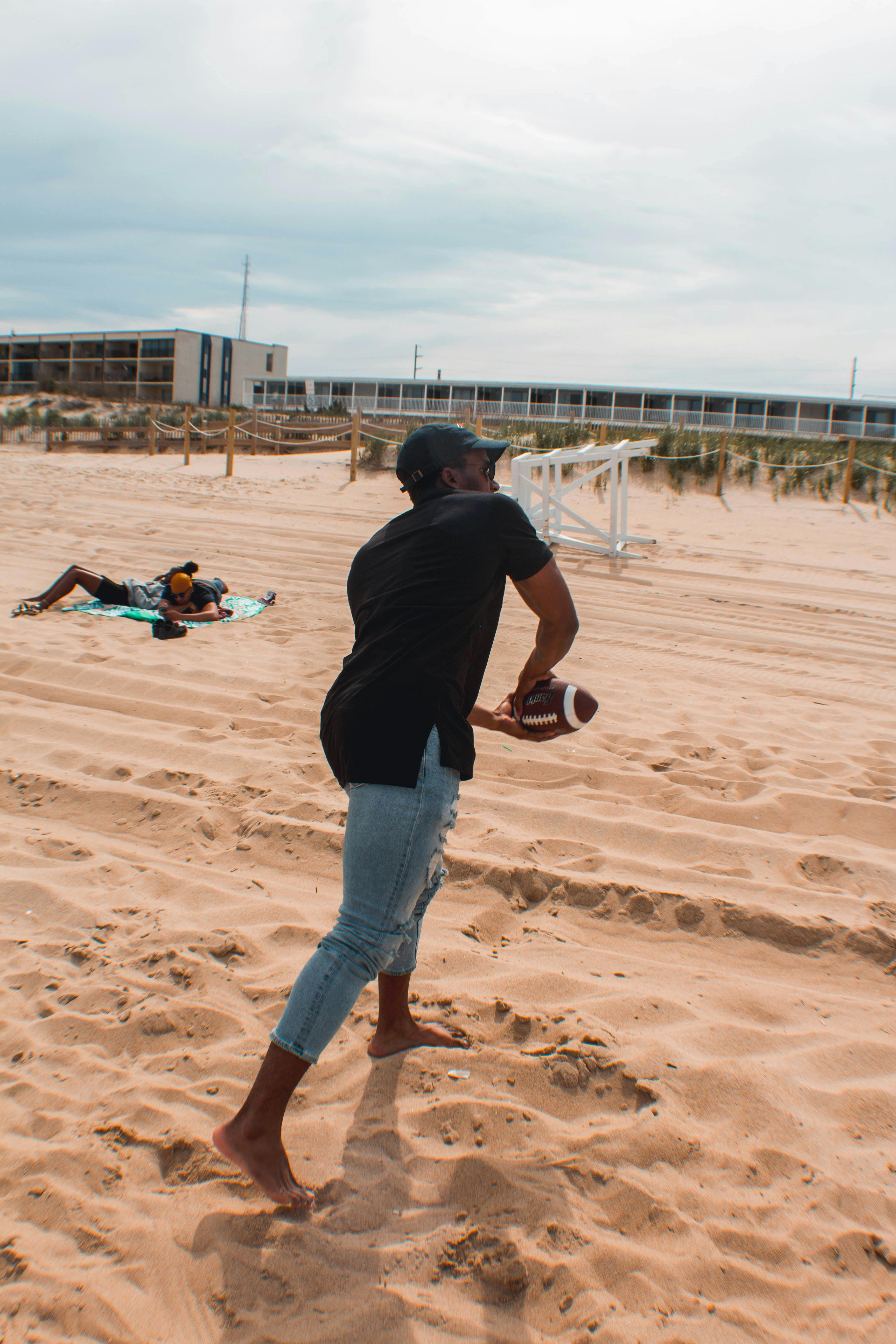 Man Playing Football On Sand · Free Stock Photo