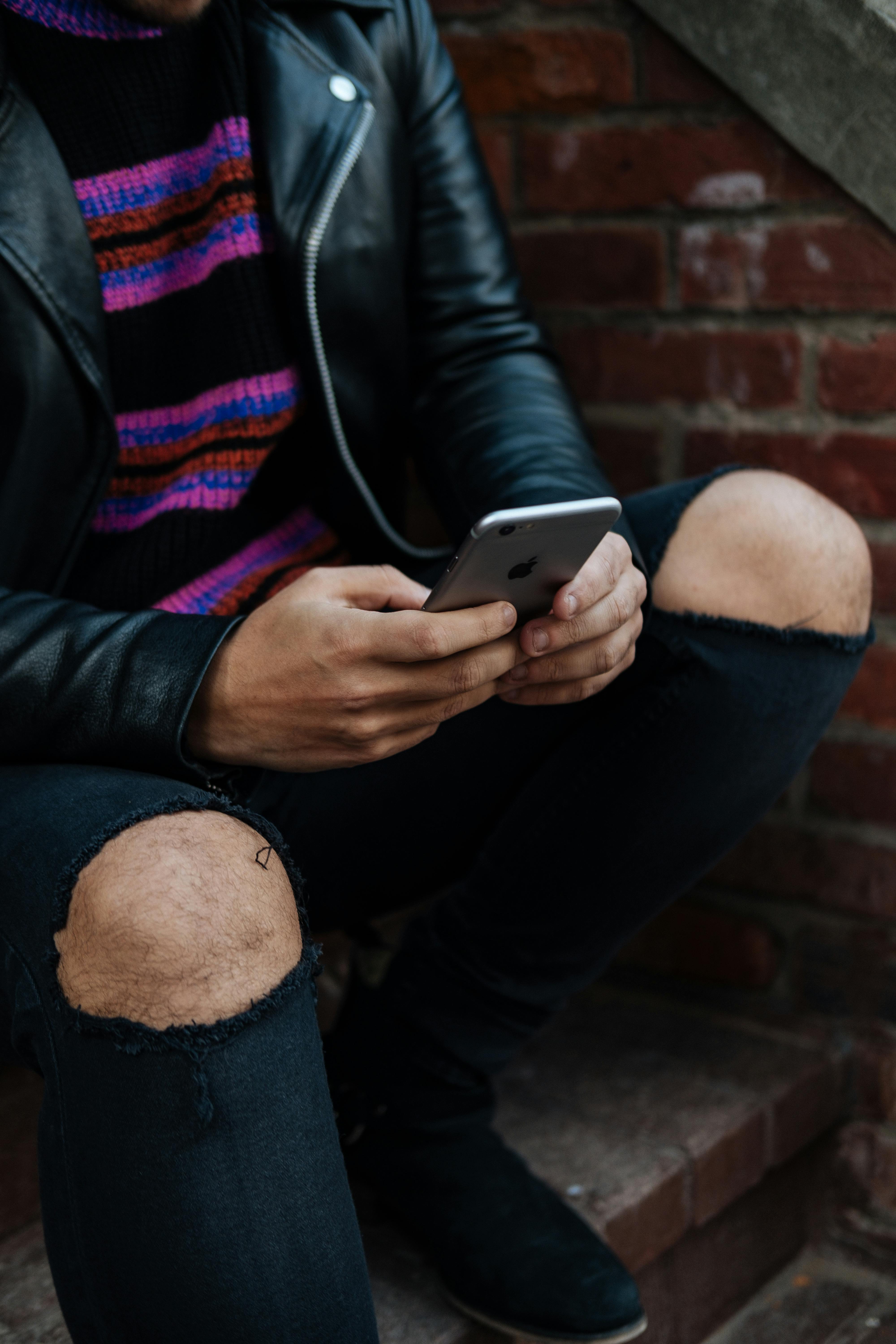 Man Holding Space Grey Iphone · Free Stock Photo