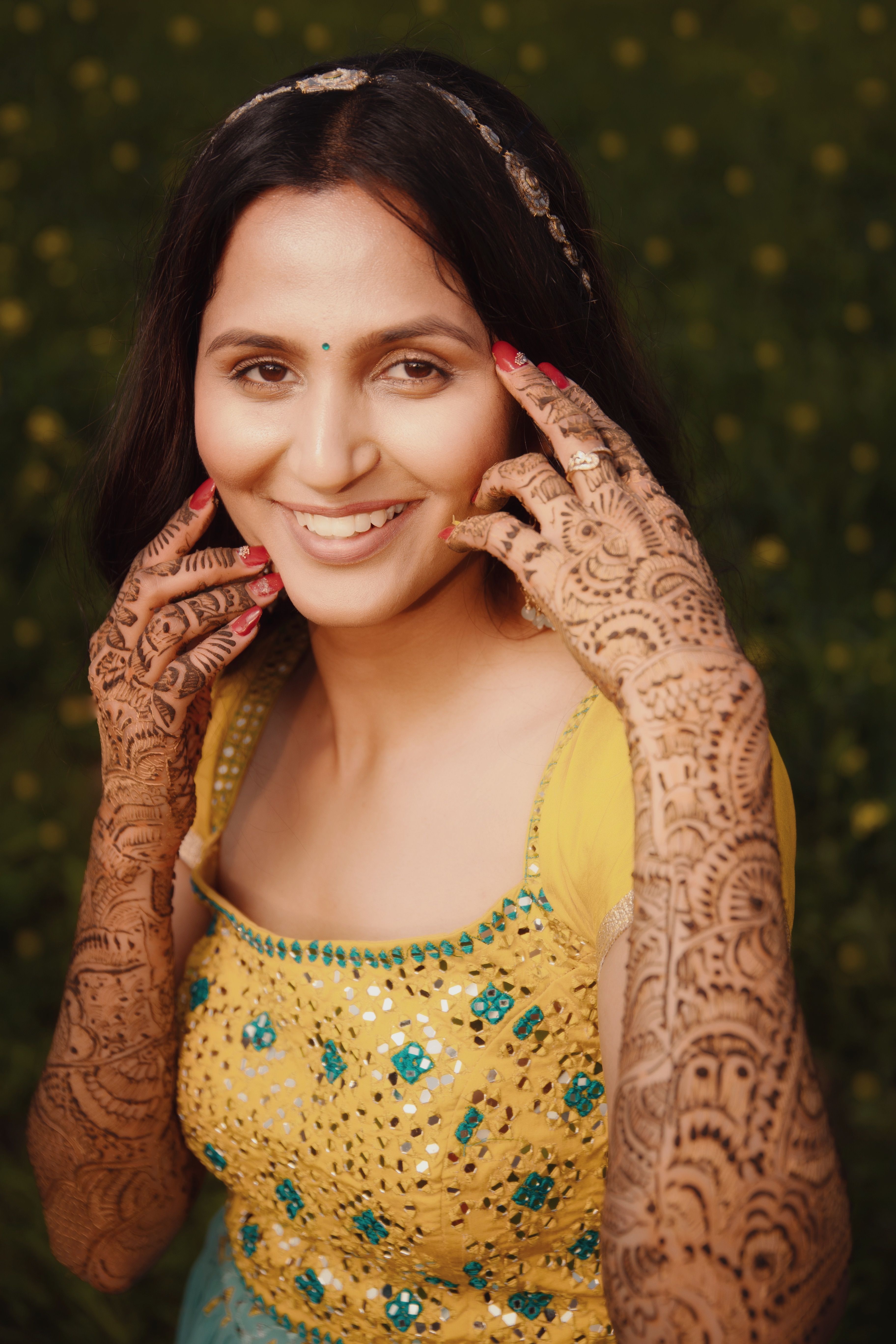 A beautiful woman in yellow and green dress with henna · Free Stock Photo