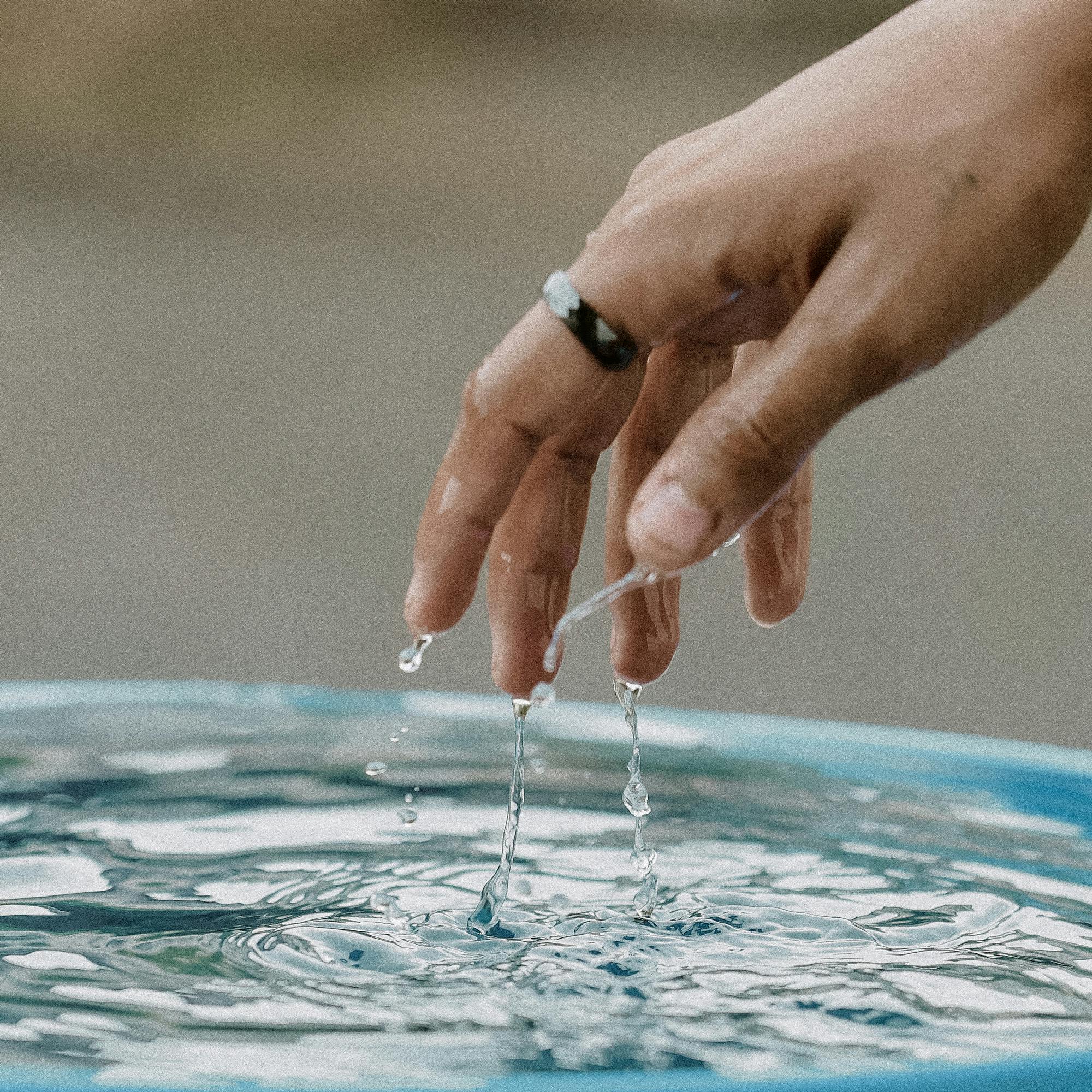 Water Dripping from Wet Hand · Free Stock Photo