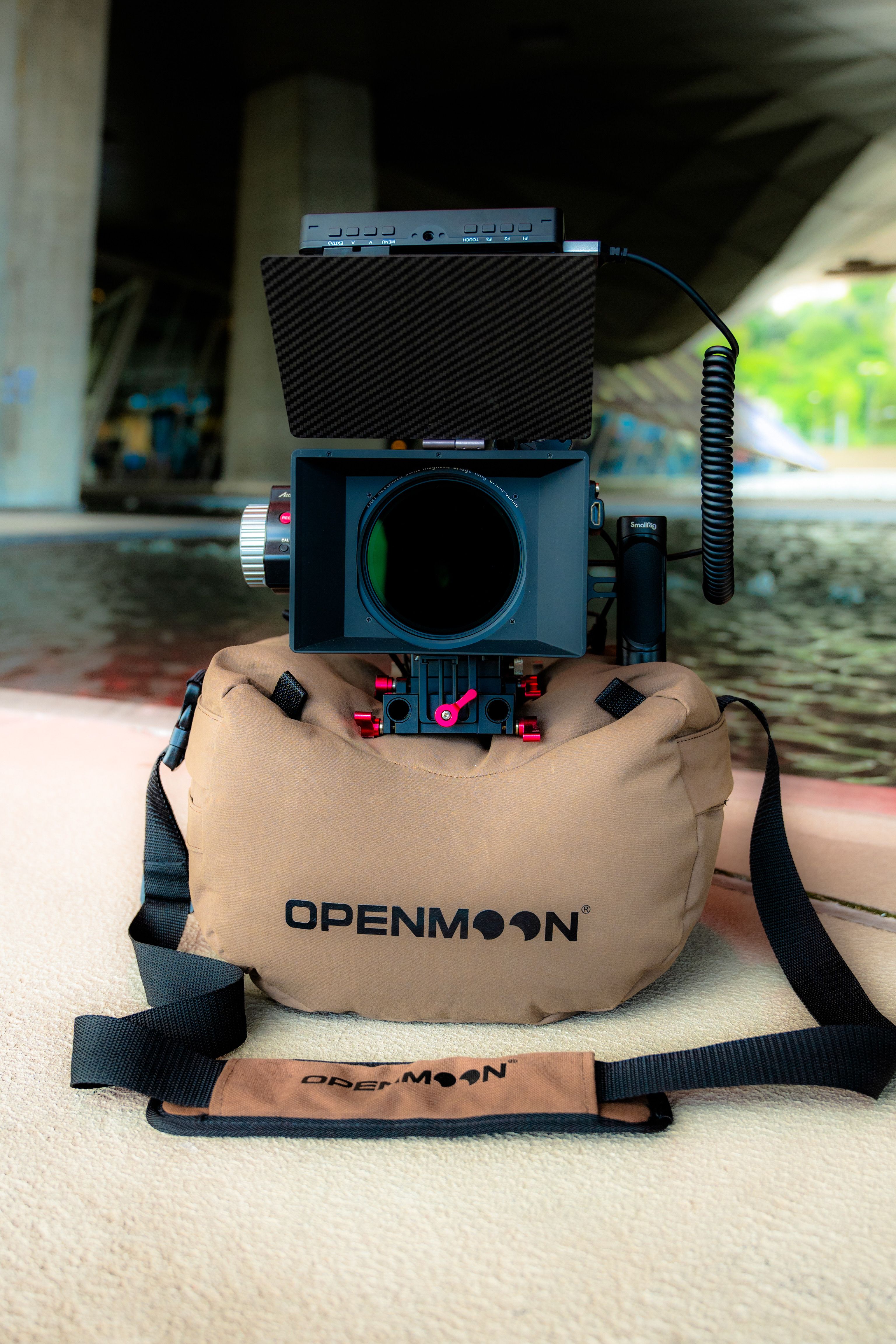 Camera on Bag near River · Free Stock Photo