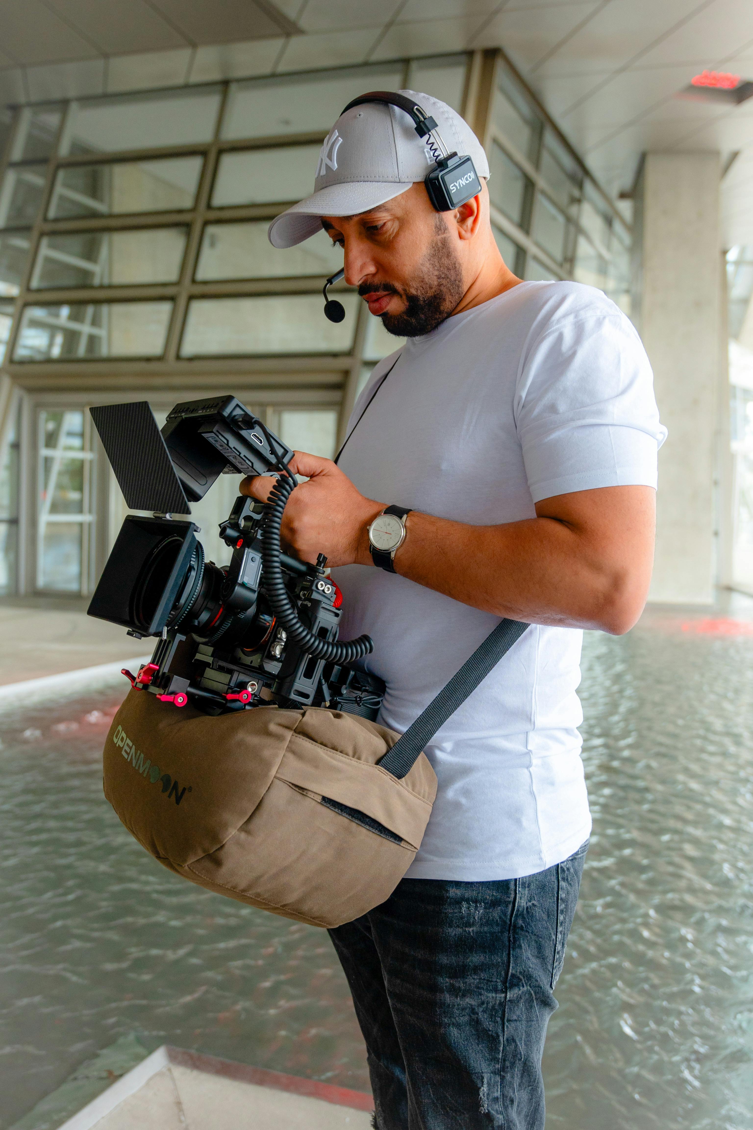 Cameraman Filming in City · Free Stock Photo