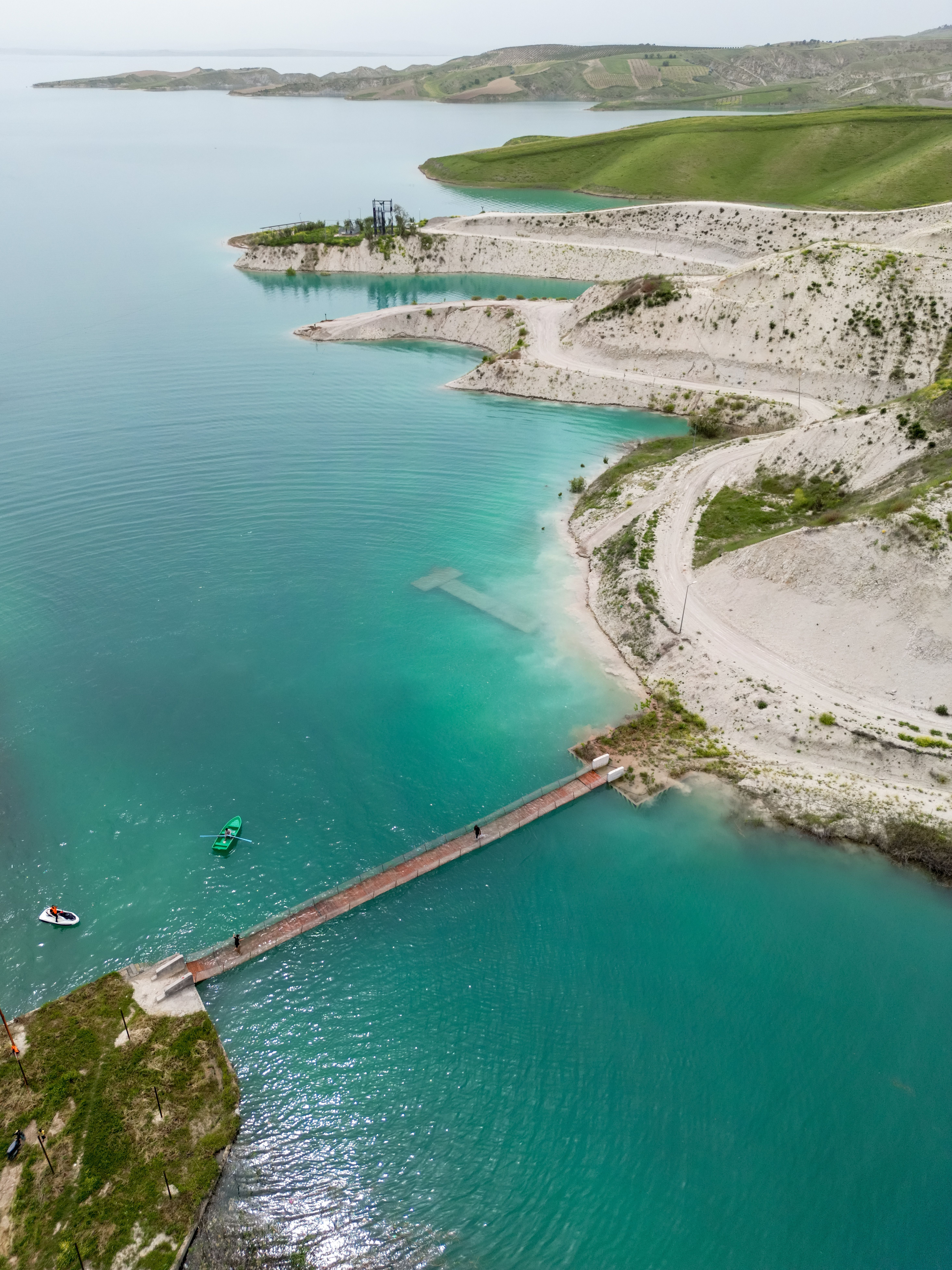 Aerial View of a Lakeshore Bridge · Free Stock Photo