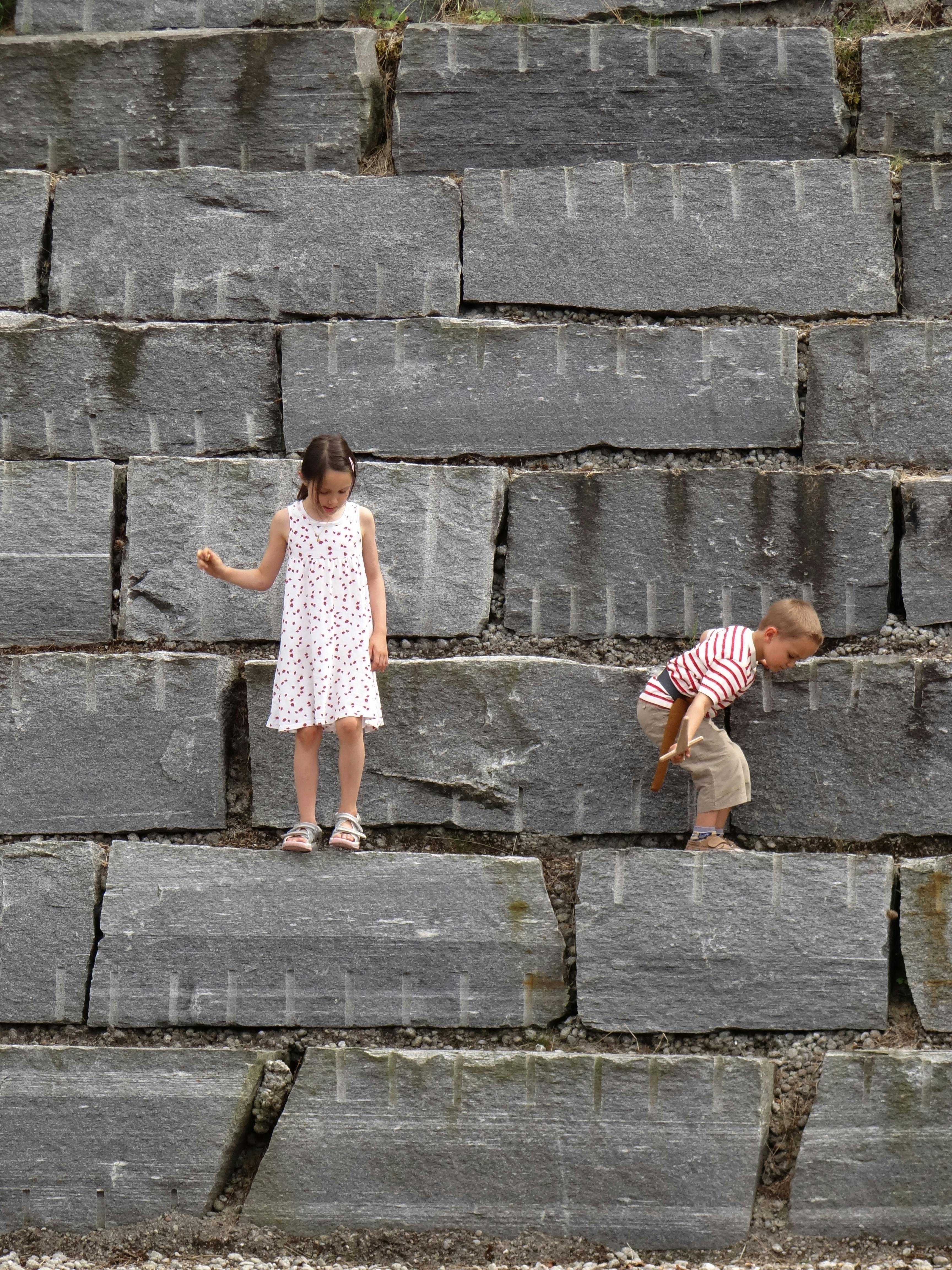 Kids on a Stone Wall · Free Stock Photo