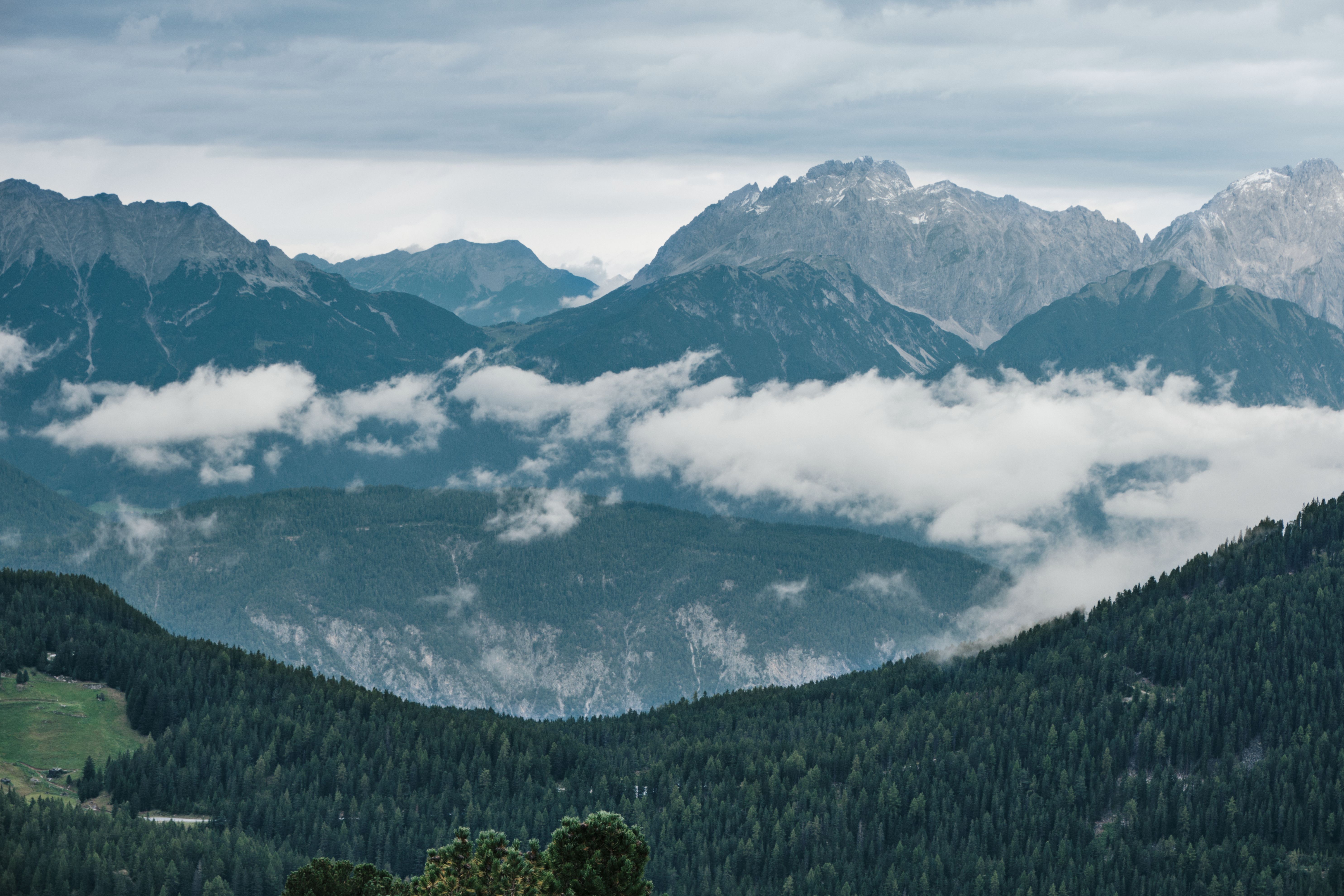 Clouds below Alpine Peaks · Free Stock Photo