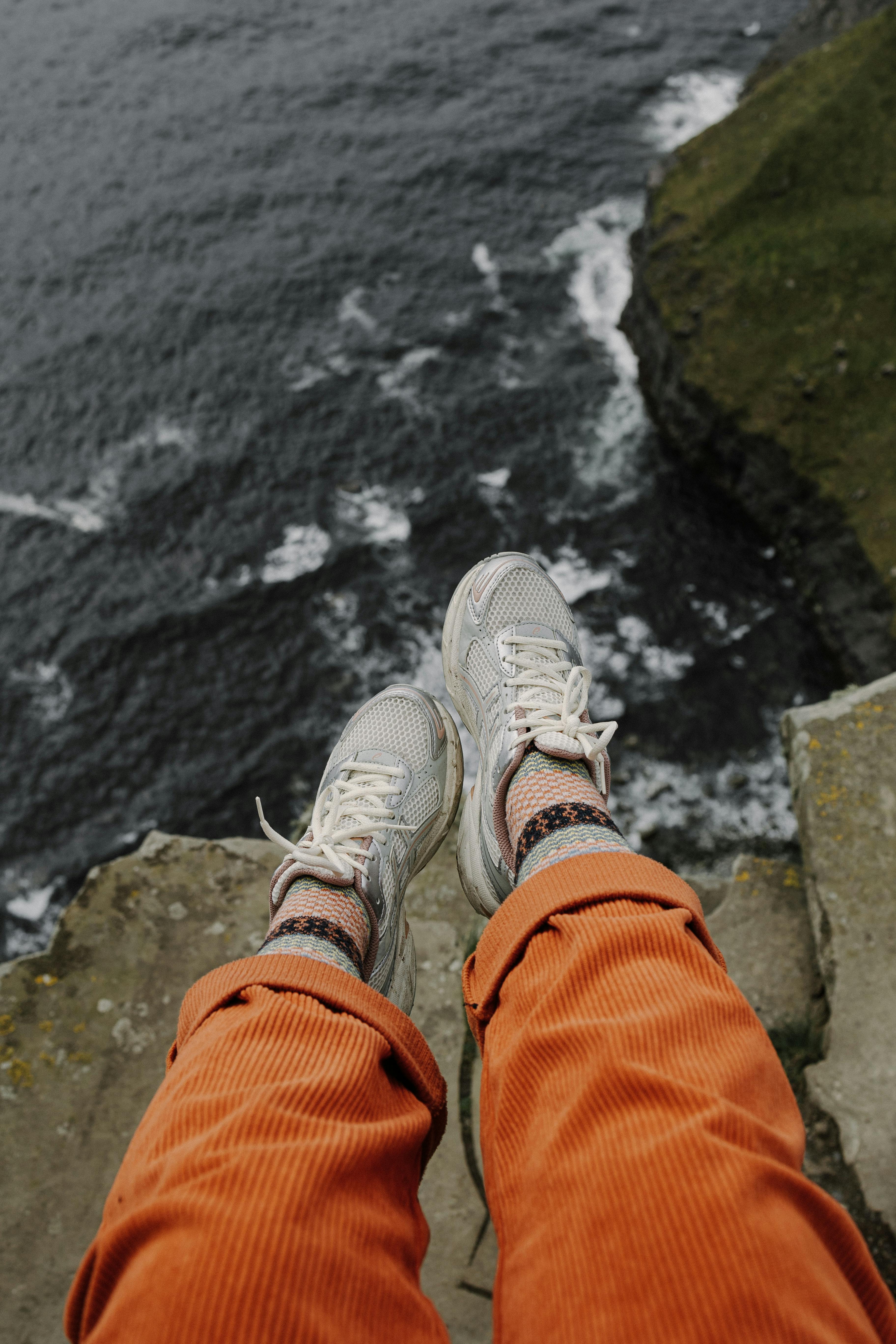 Man Standing on Edge of Mountain · Free Stock Photo