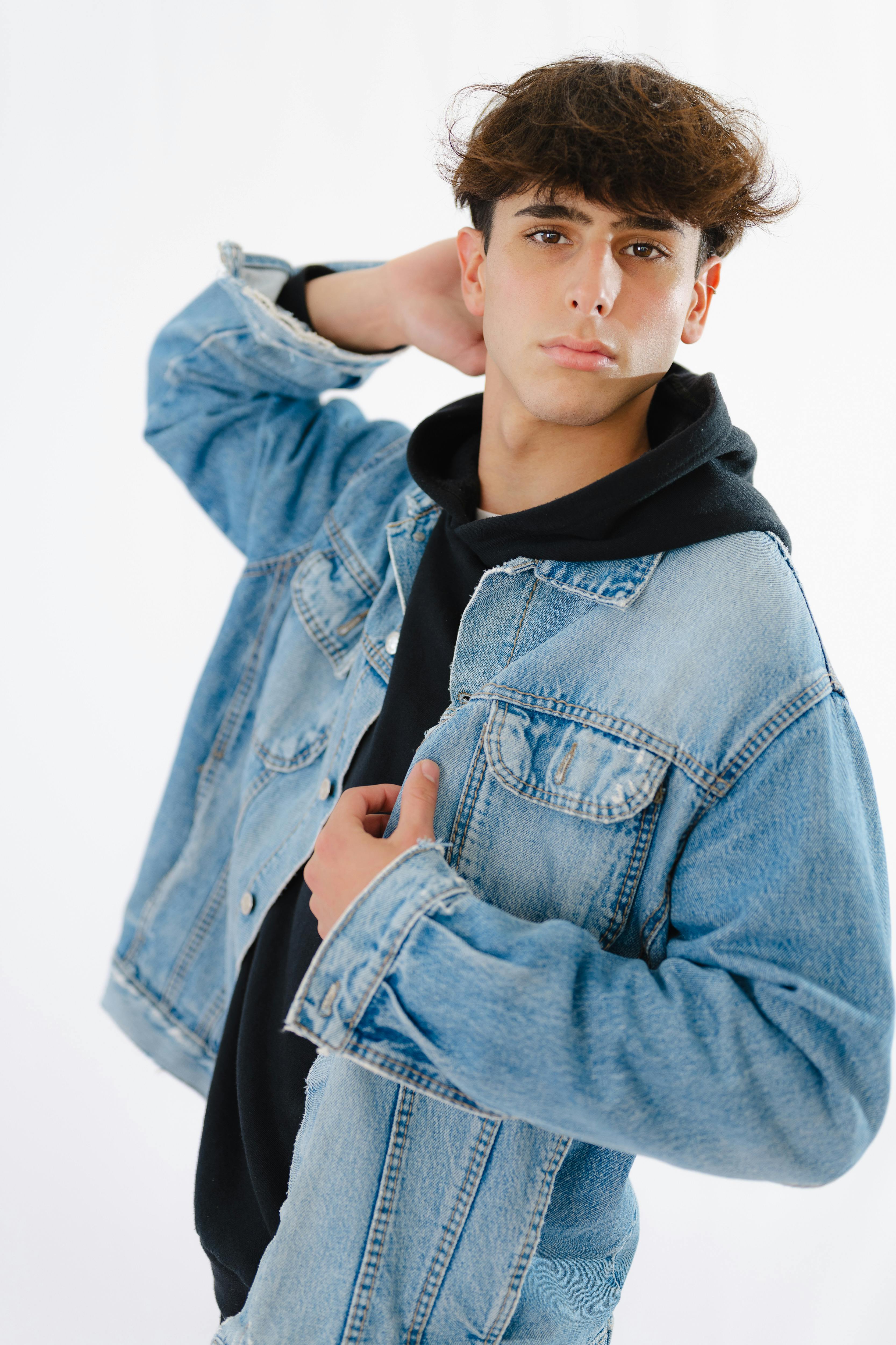 Model in Denim Jacket Over Black Hoodie · Free Stock Photo