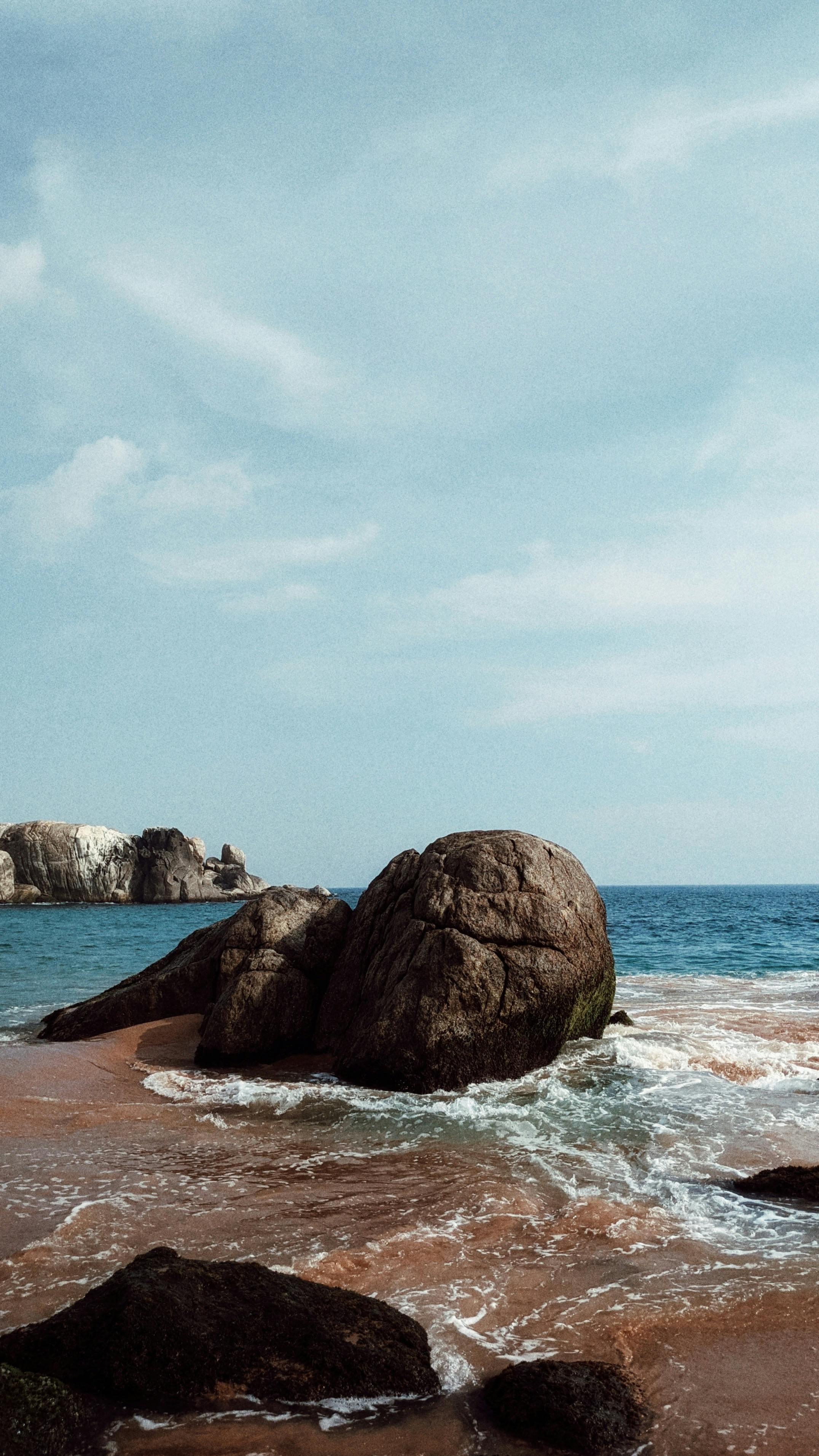 Ocean Washing Rocks on Beach · Free Stock Photo
