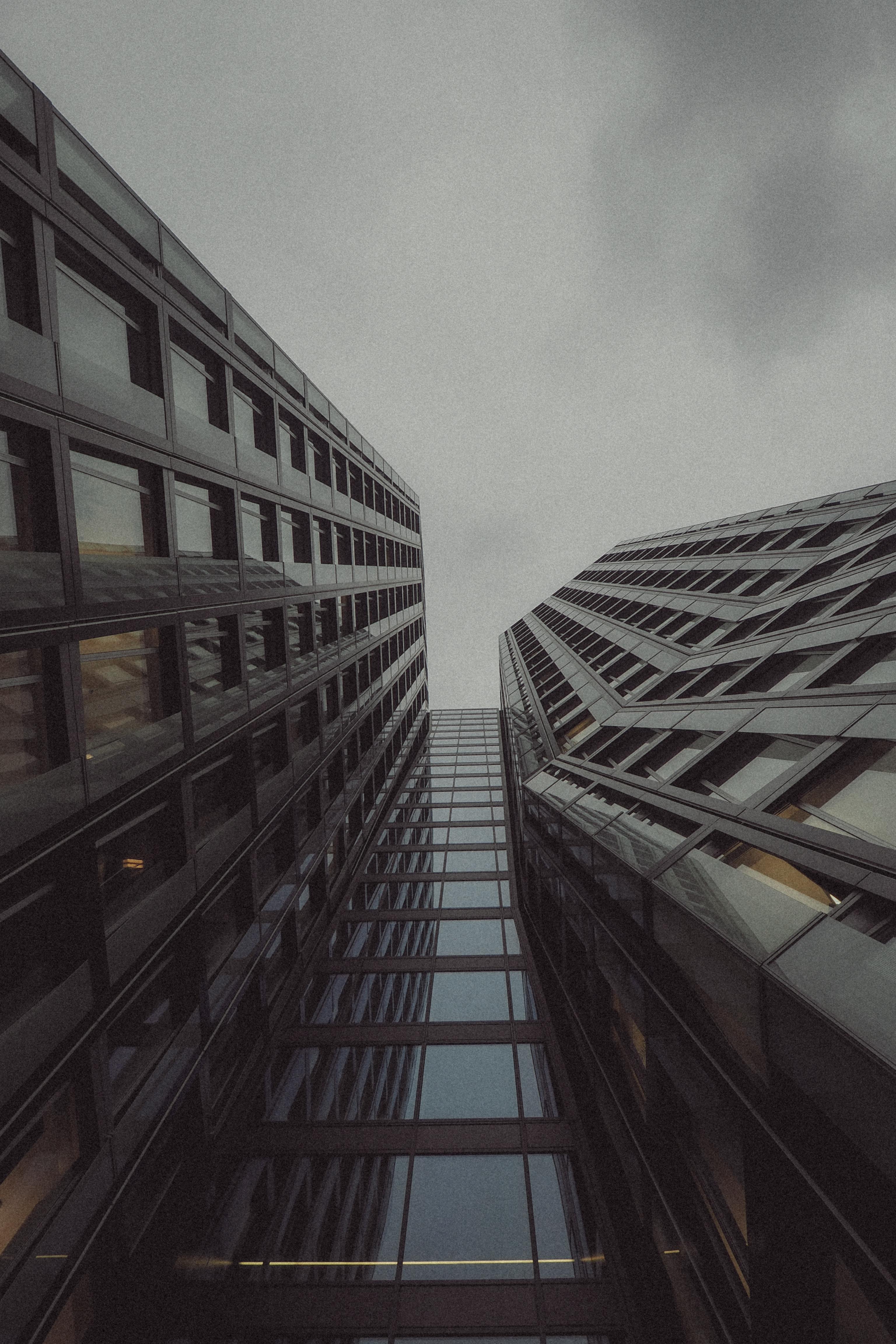 A view of tall buildings from the ground · Free Stock Photo