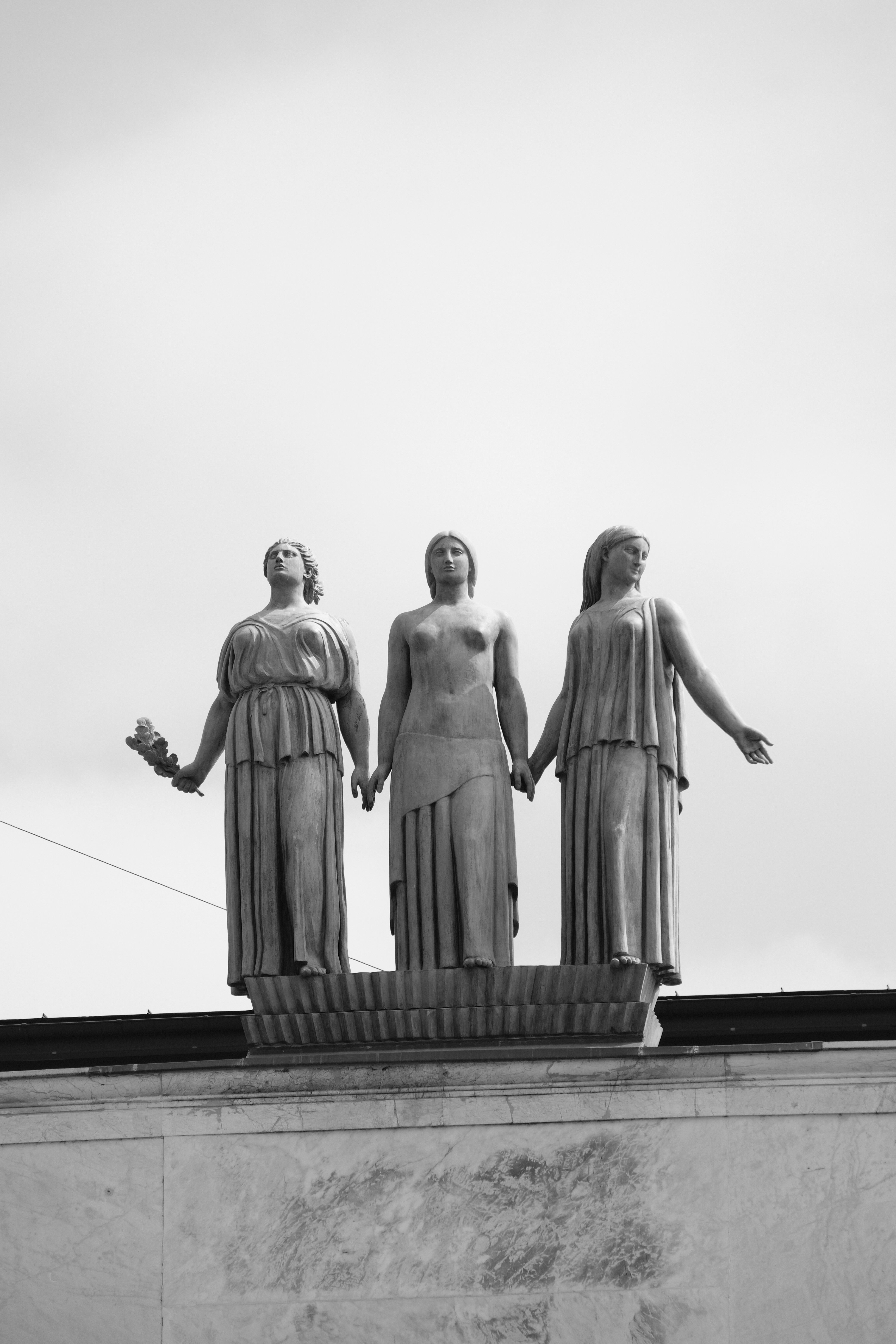 Three statues of women on top of a building · Free Stock Photo