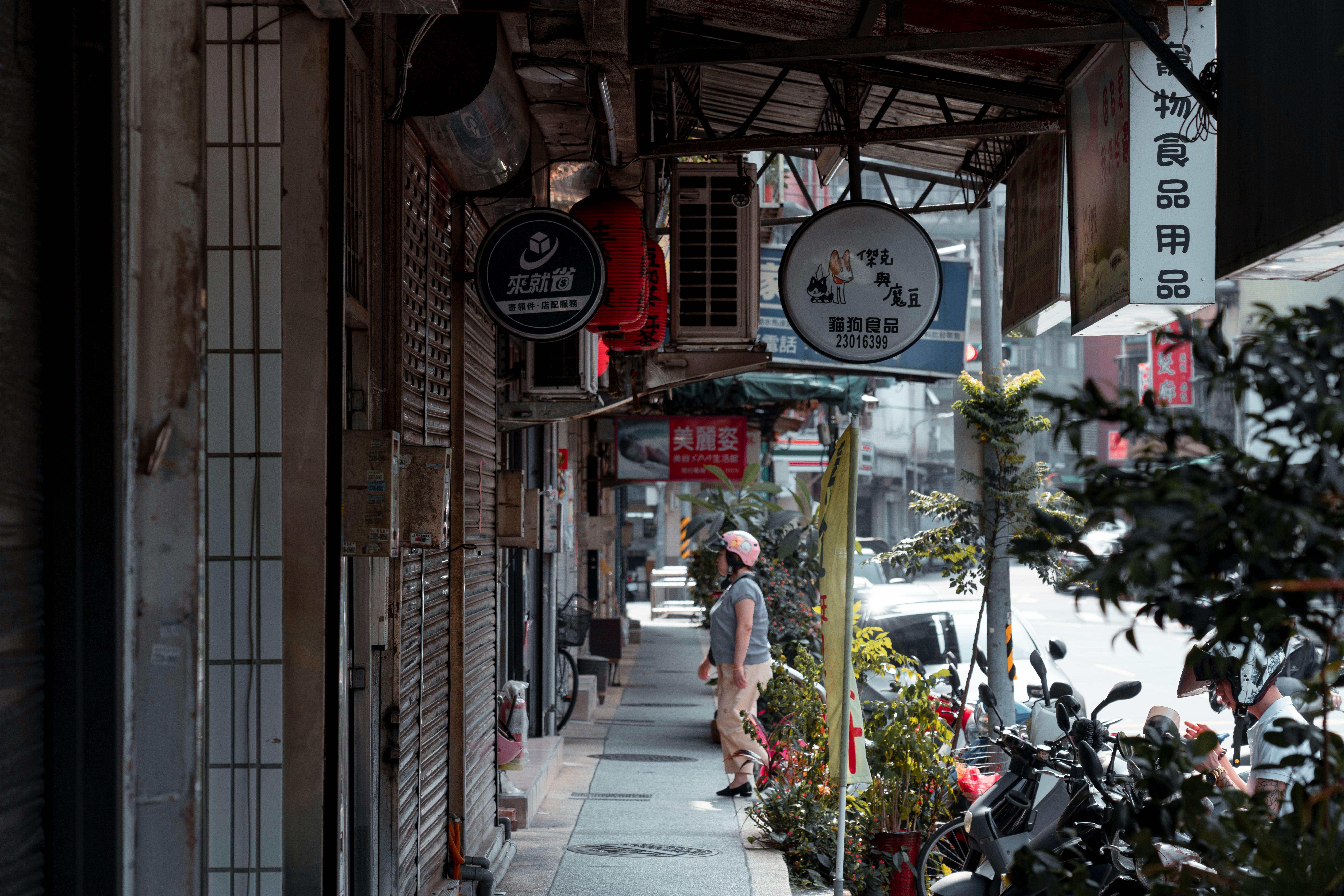 Narrow Sidewalk with Store Fronts in Asian City · Free Stock Photo
