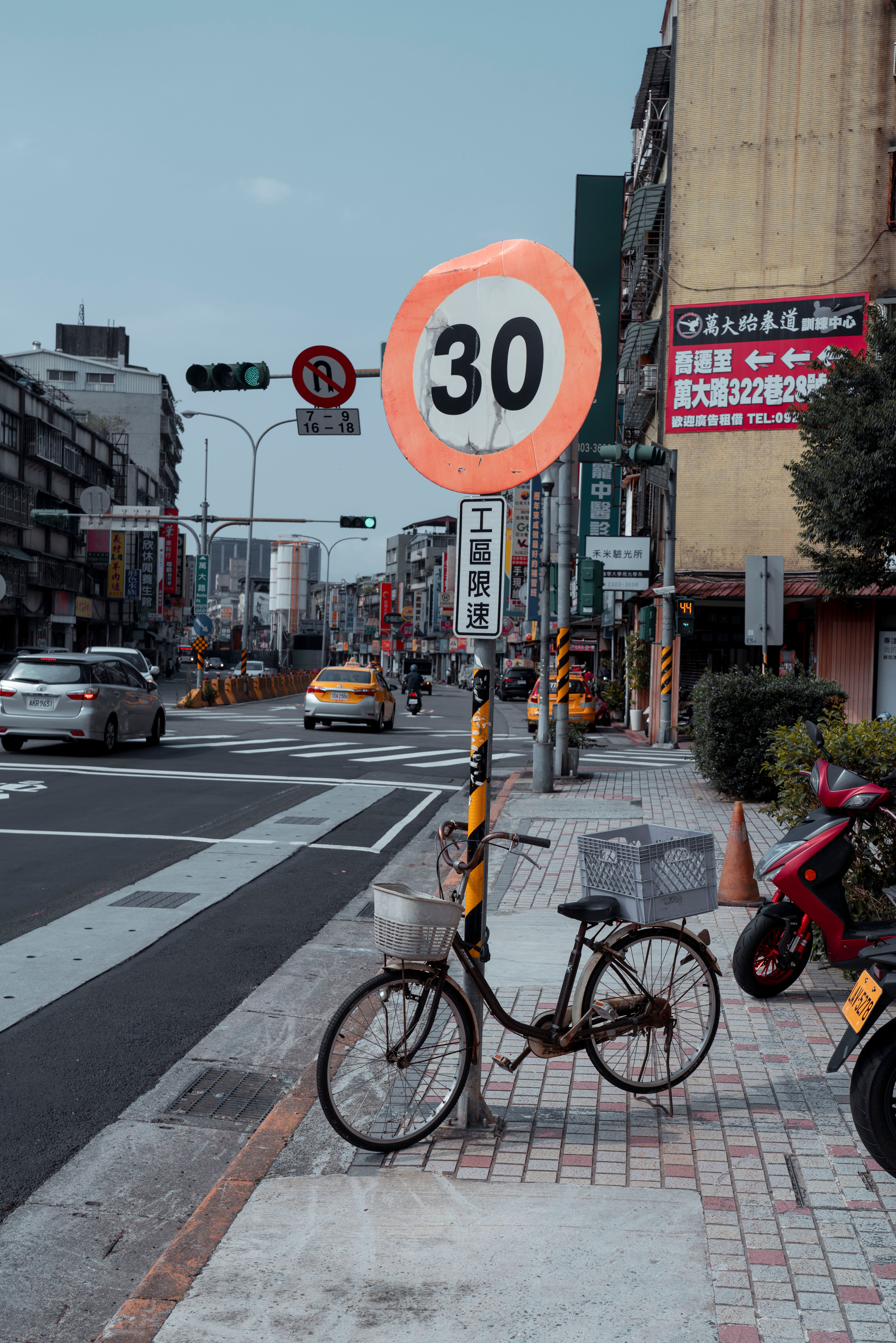 Speed Limiting Traffic Sign on a Street in Asian Country · Free Stock Photo