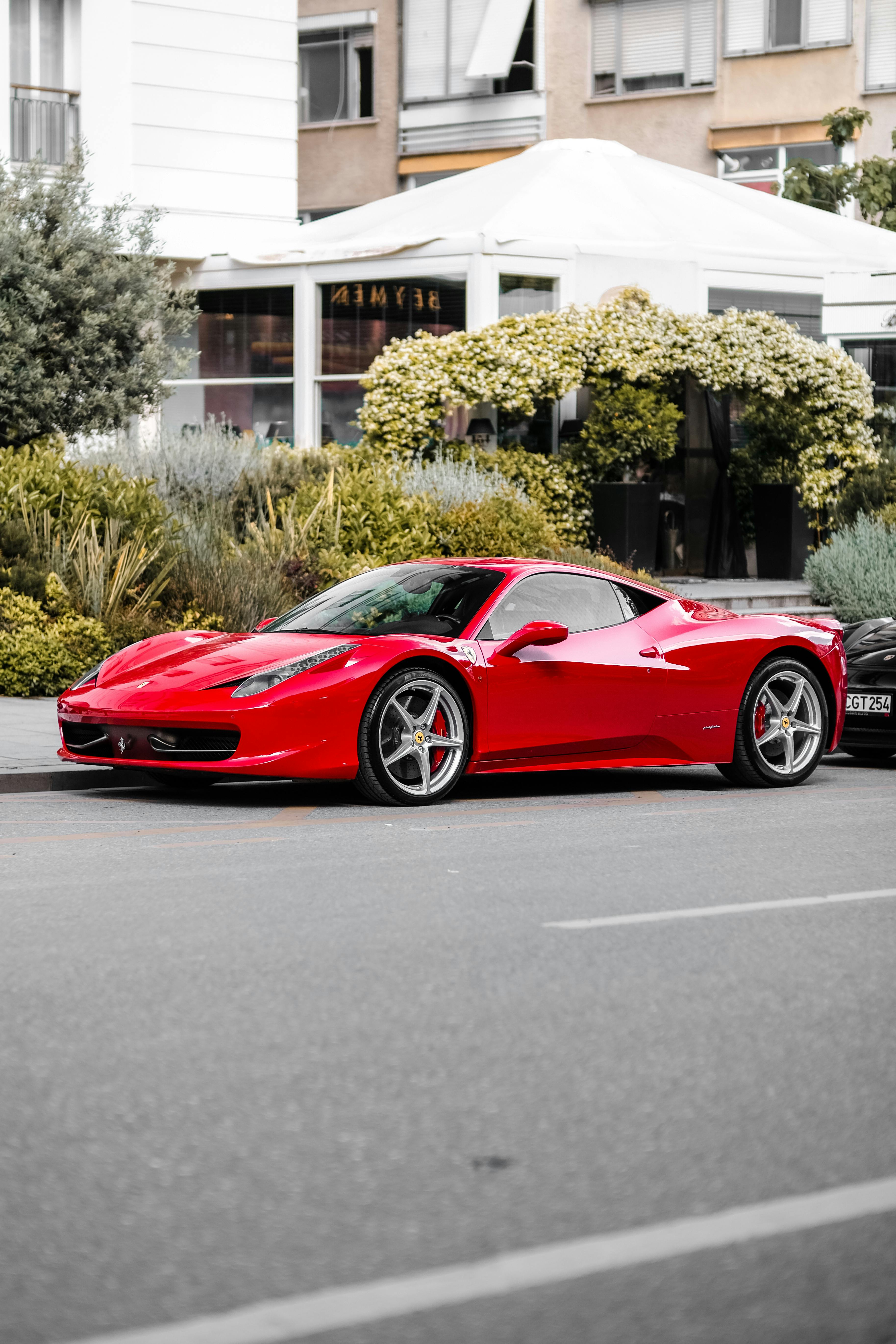 Red Ferrari Parked on the Street · Free Stock Photo