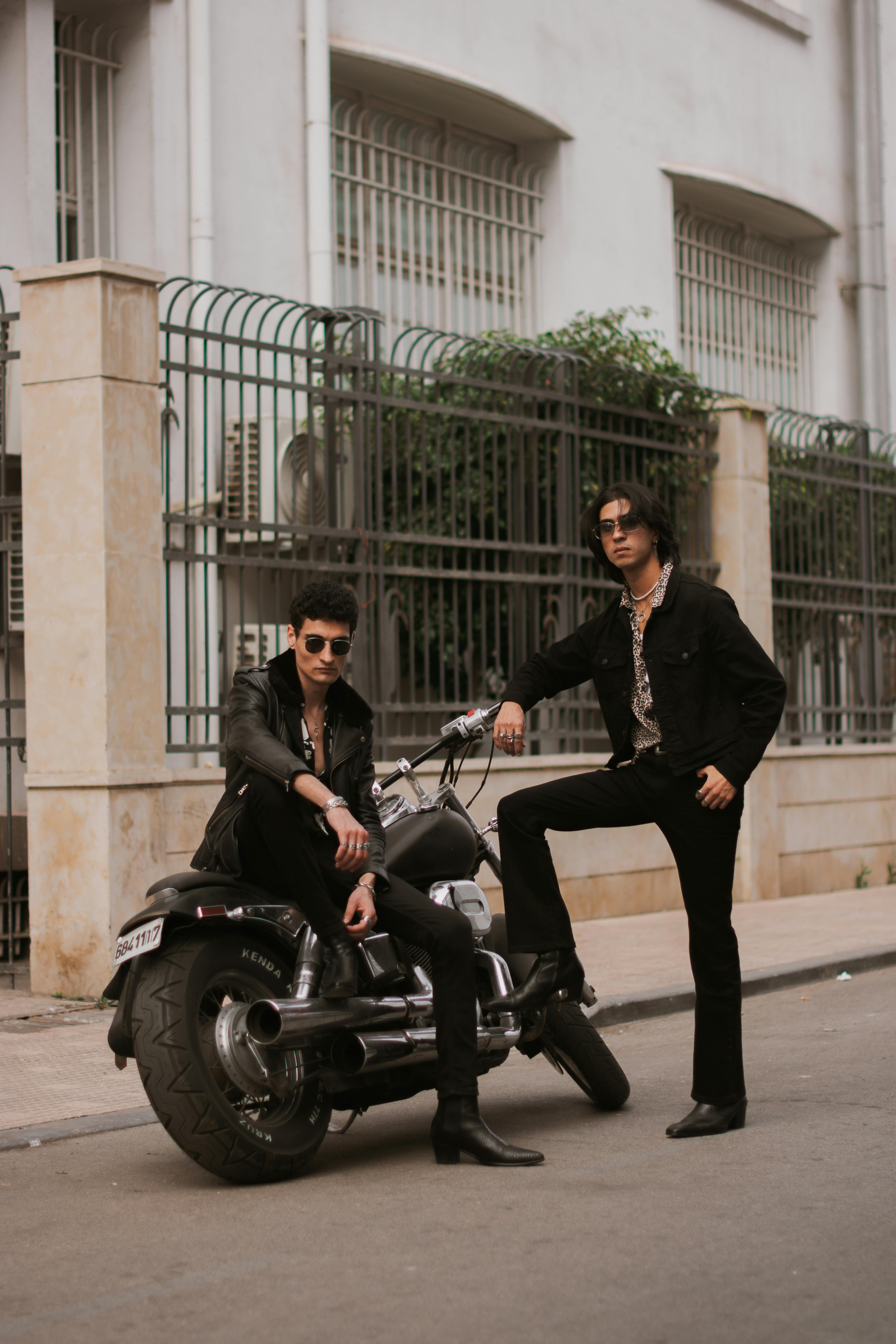 Men in Black Clothing Leaning against Motorcycle · Free Stock Photo