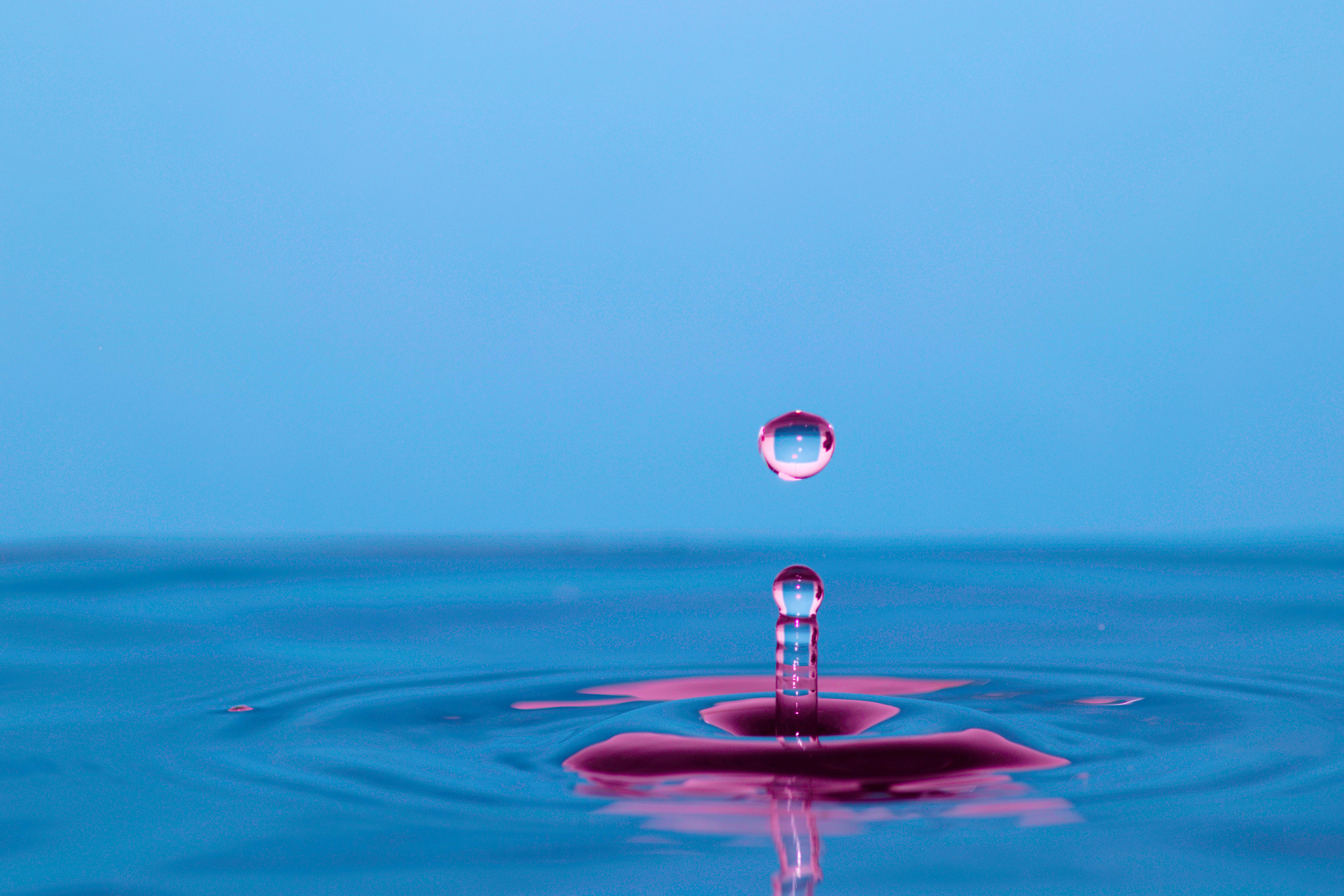 Drops of Water Bouncing off of Water Surface · Free Stock Photo