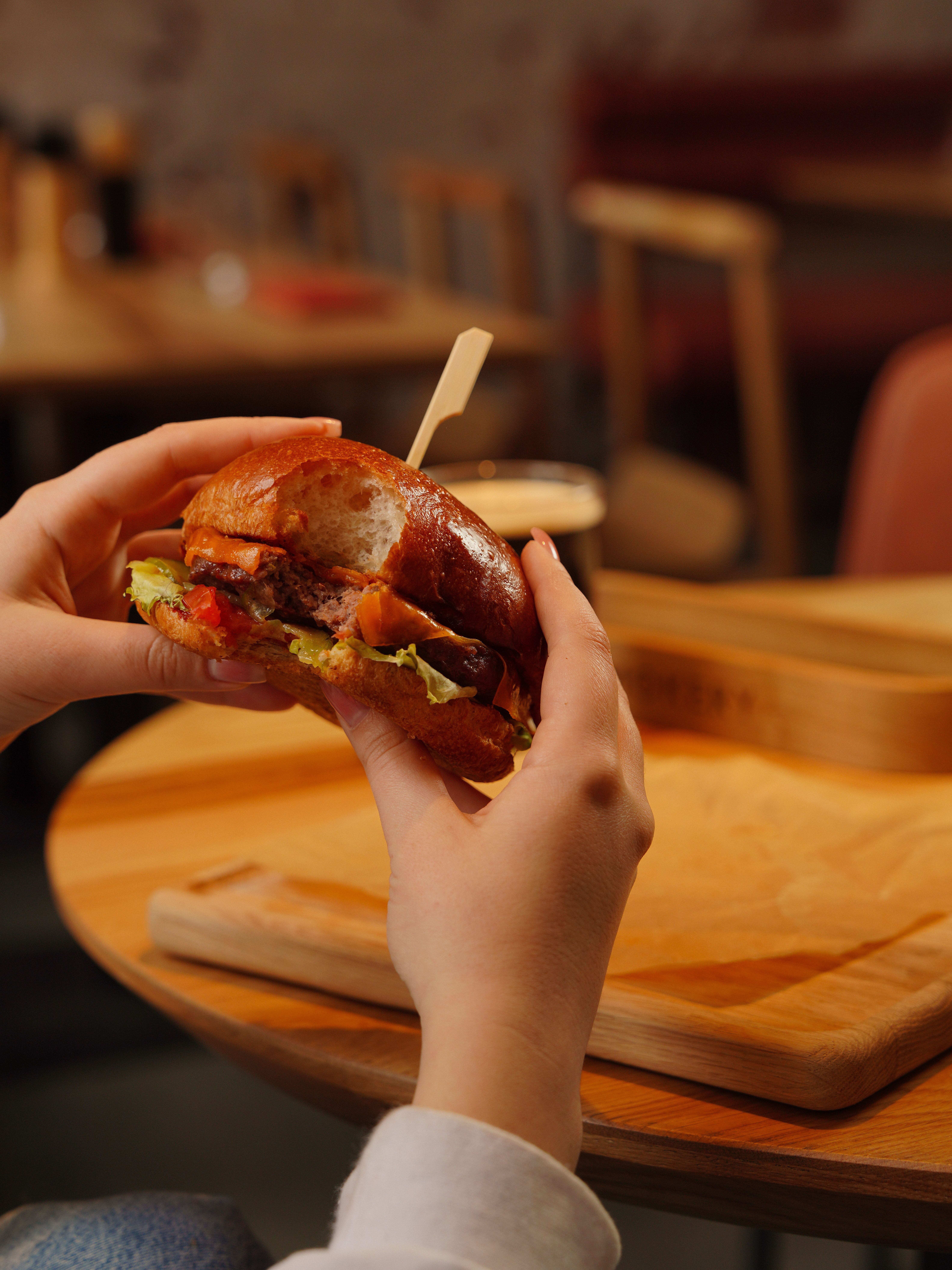 Close-up of a Woman Eating a Burger · Free Stock Photo