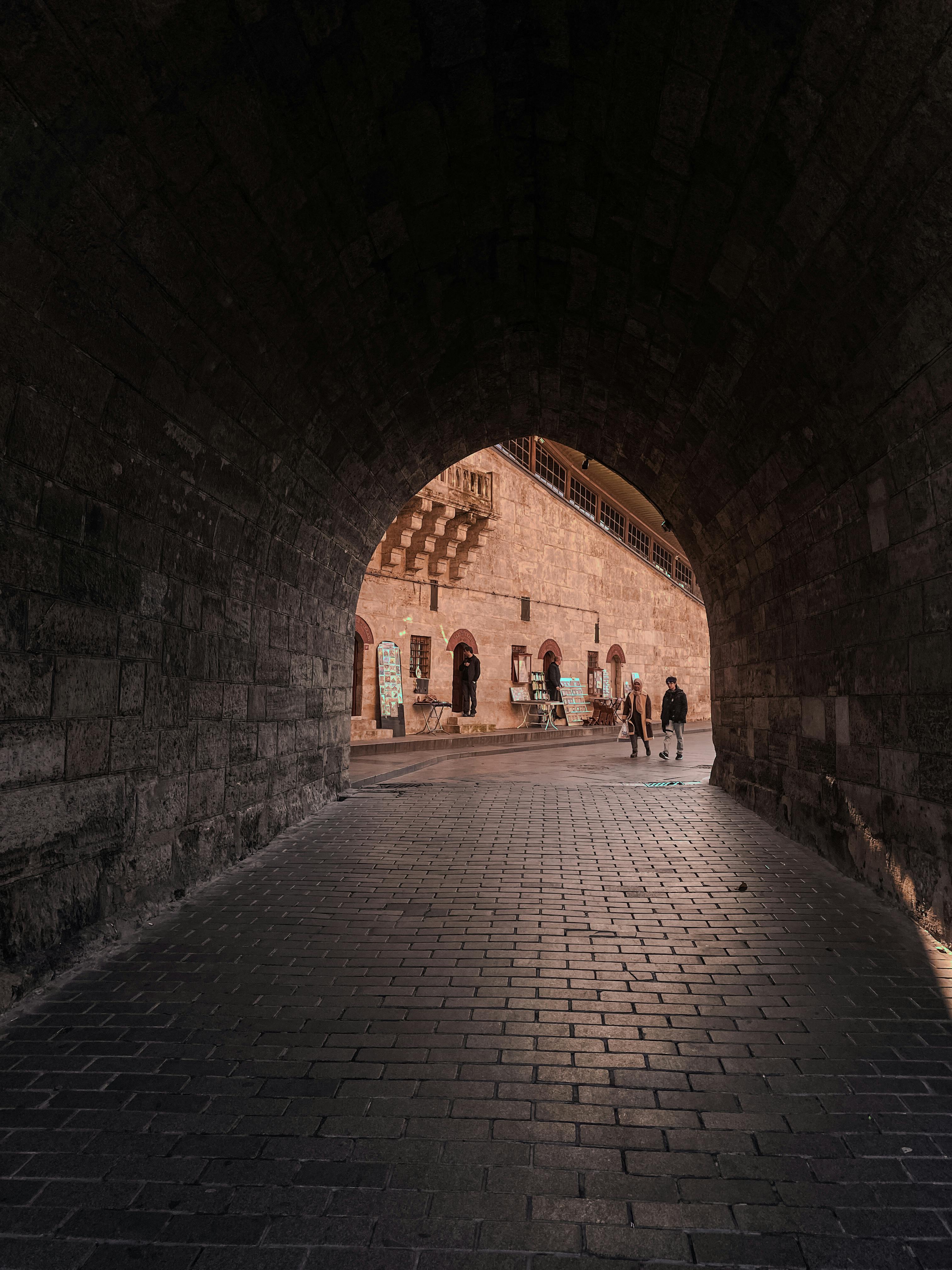 Man Standing Under Arch · Free Stock Photo
