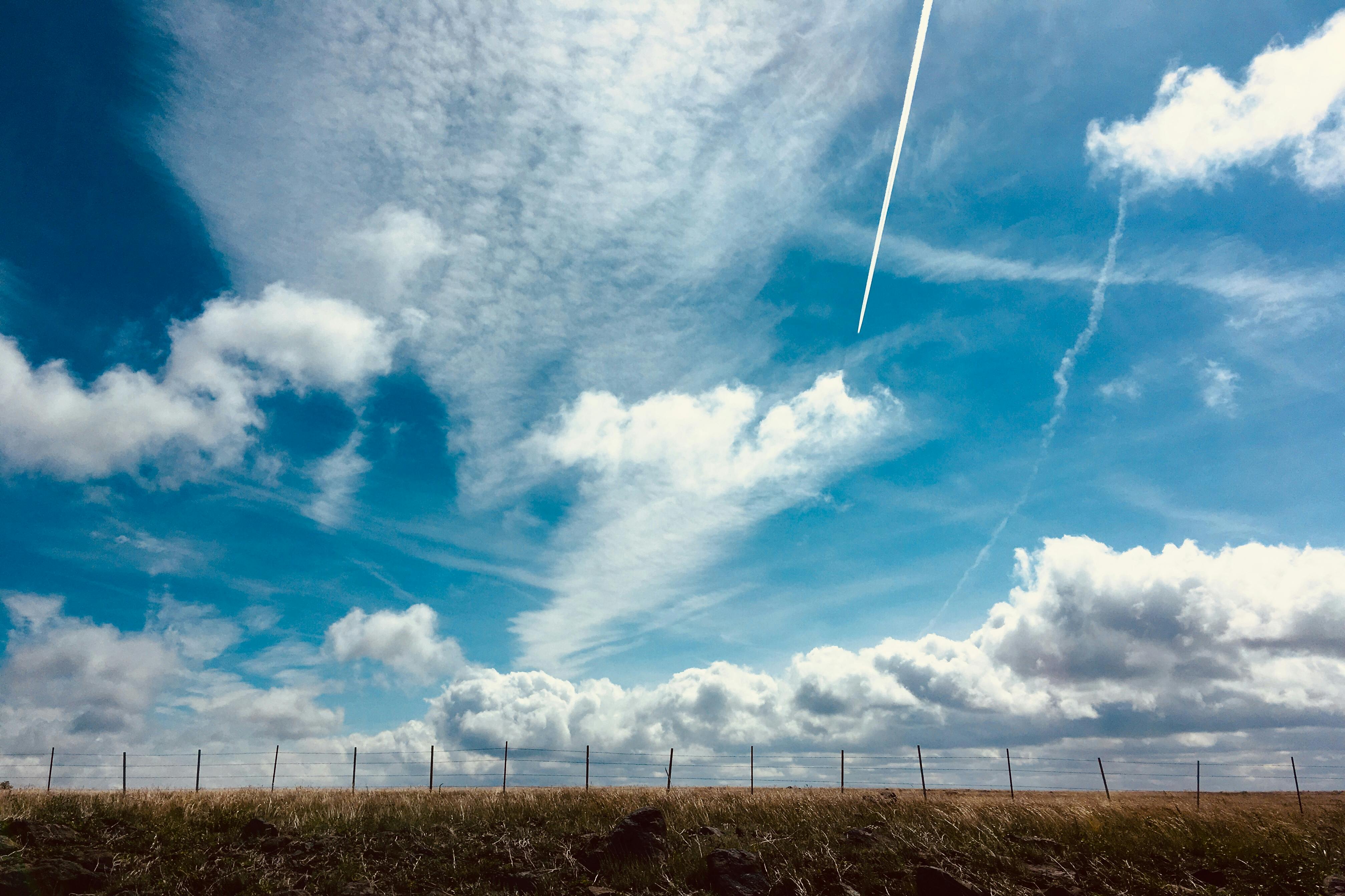 White Clouds and Green Field Horizon · Free Stock Photo