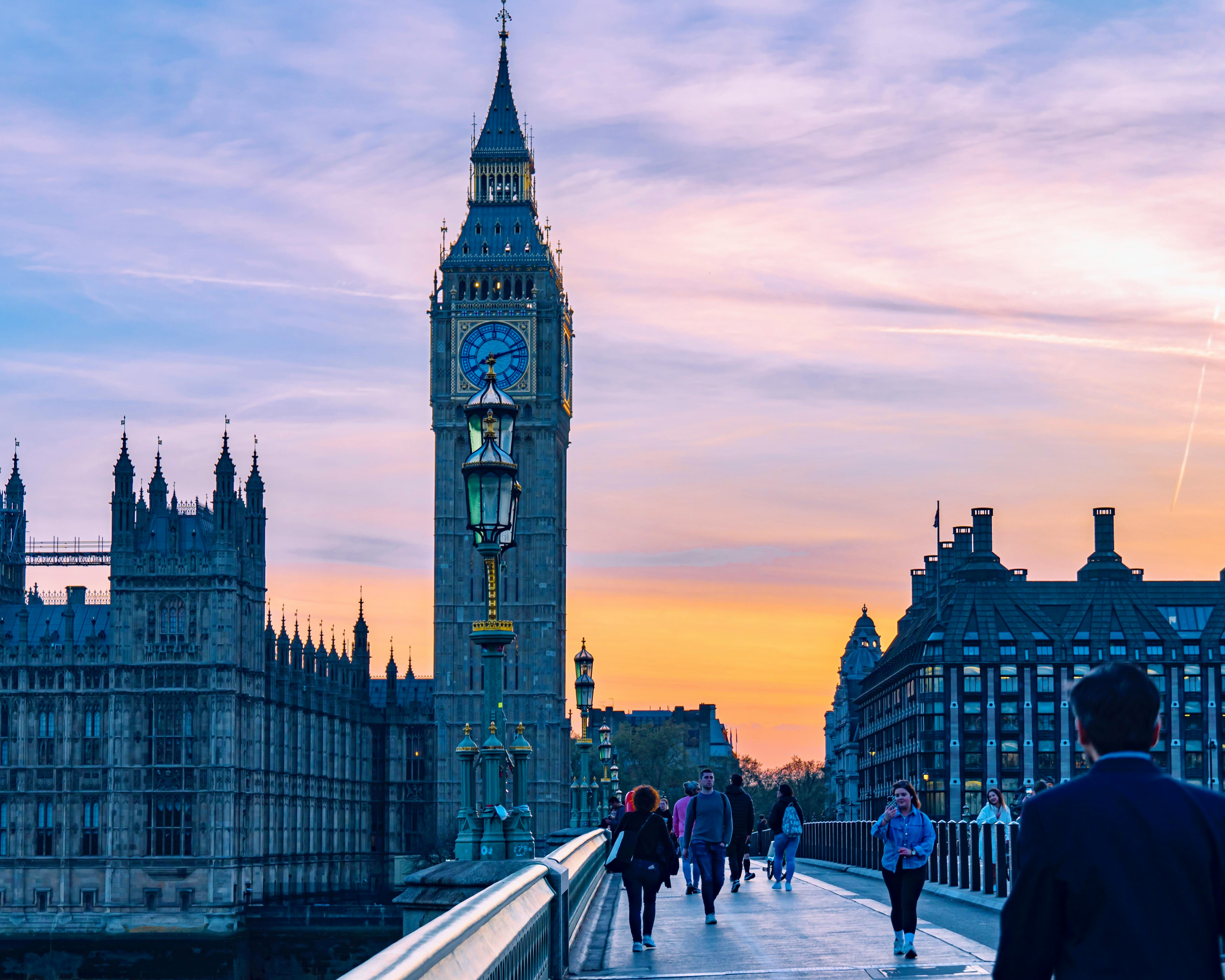 View of the Big Ben and the Palace of Westminster from the Westminster Bridge at Sunset · Free ...