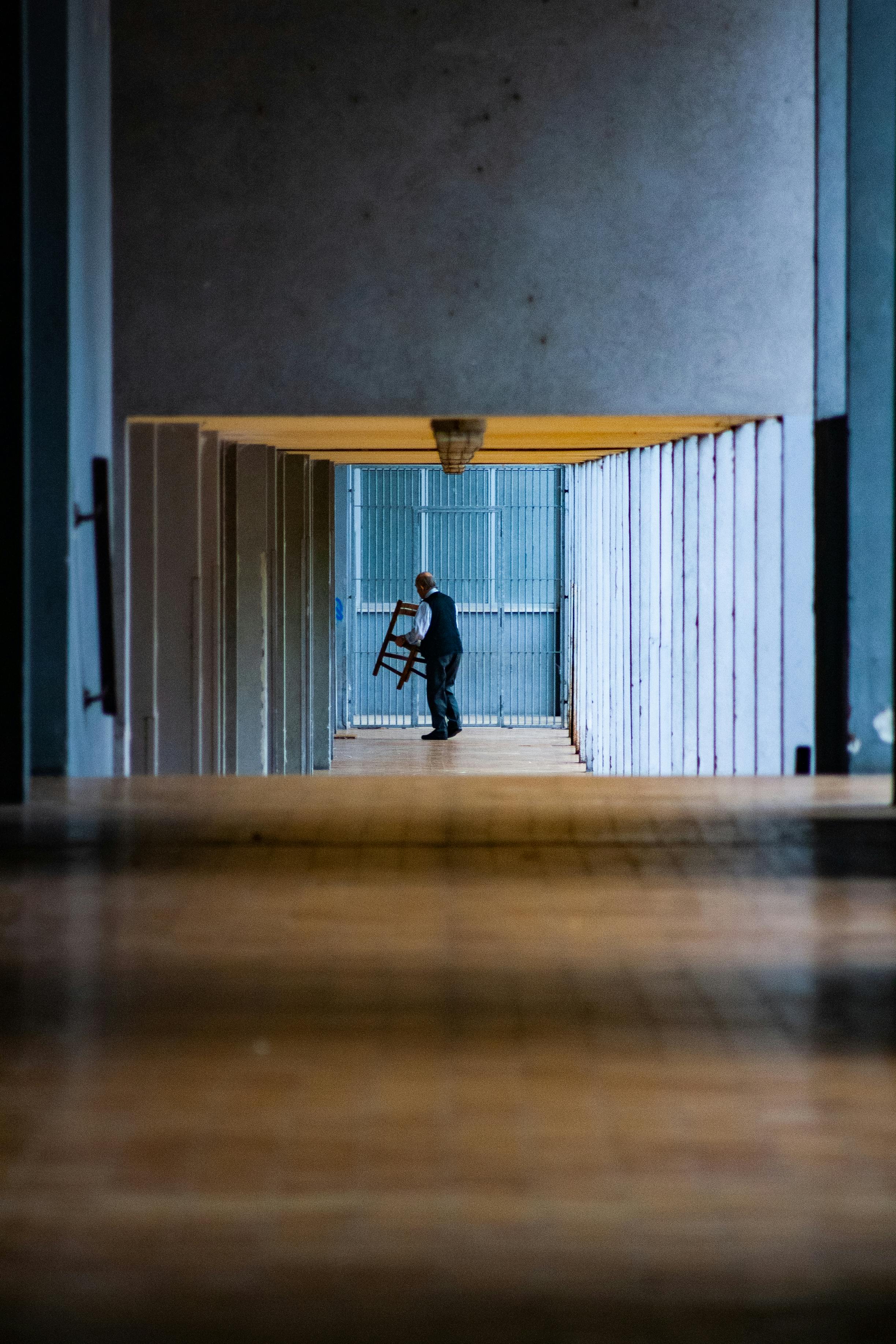 Person Carrying Chair · Free Stock Photo
