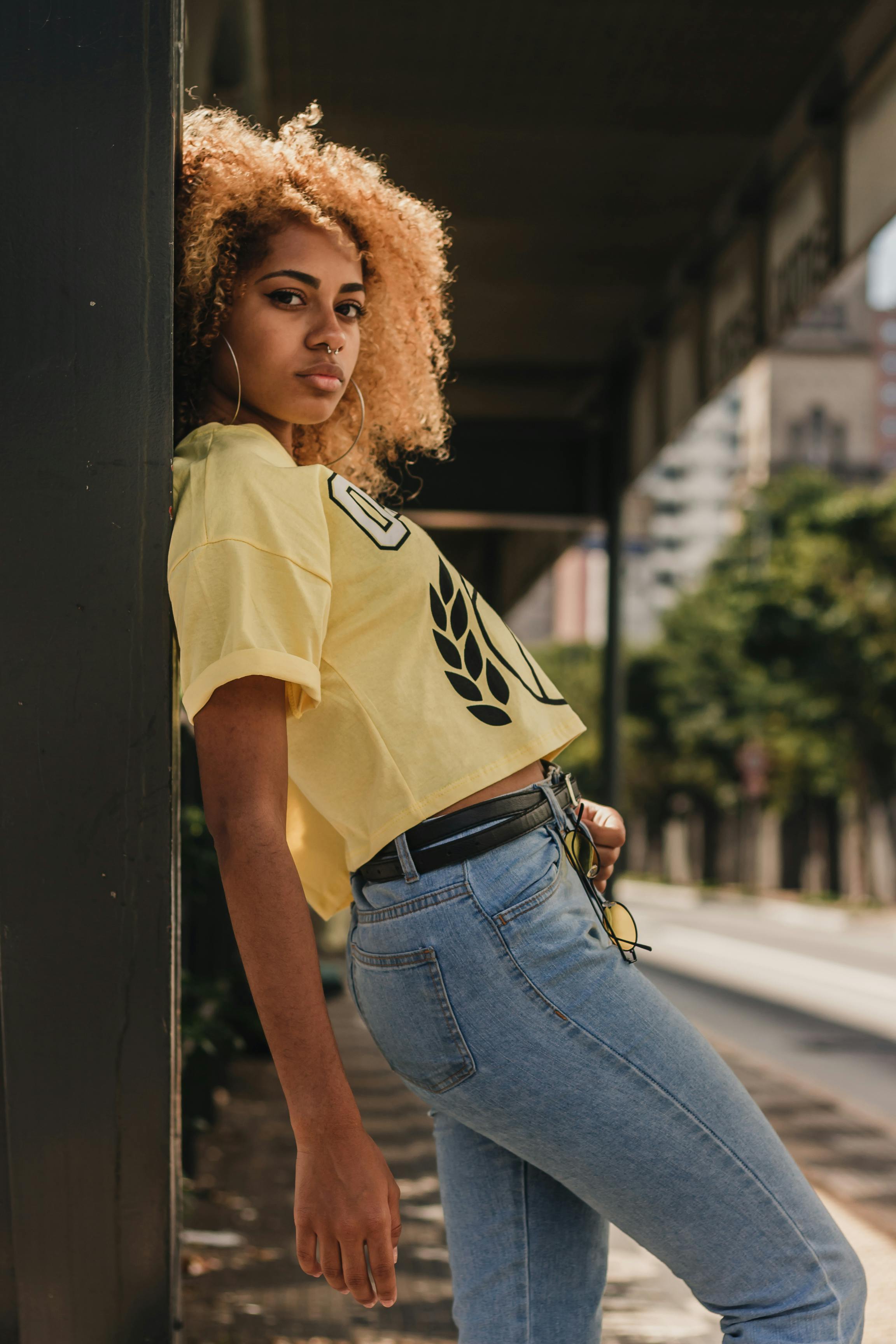 Woman Wearing Blue Strapless Dress Holding White and Gray Plastic ...