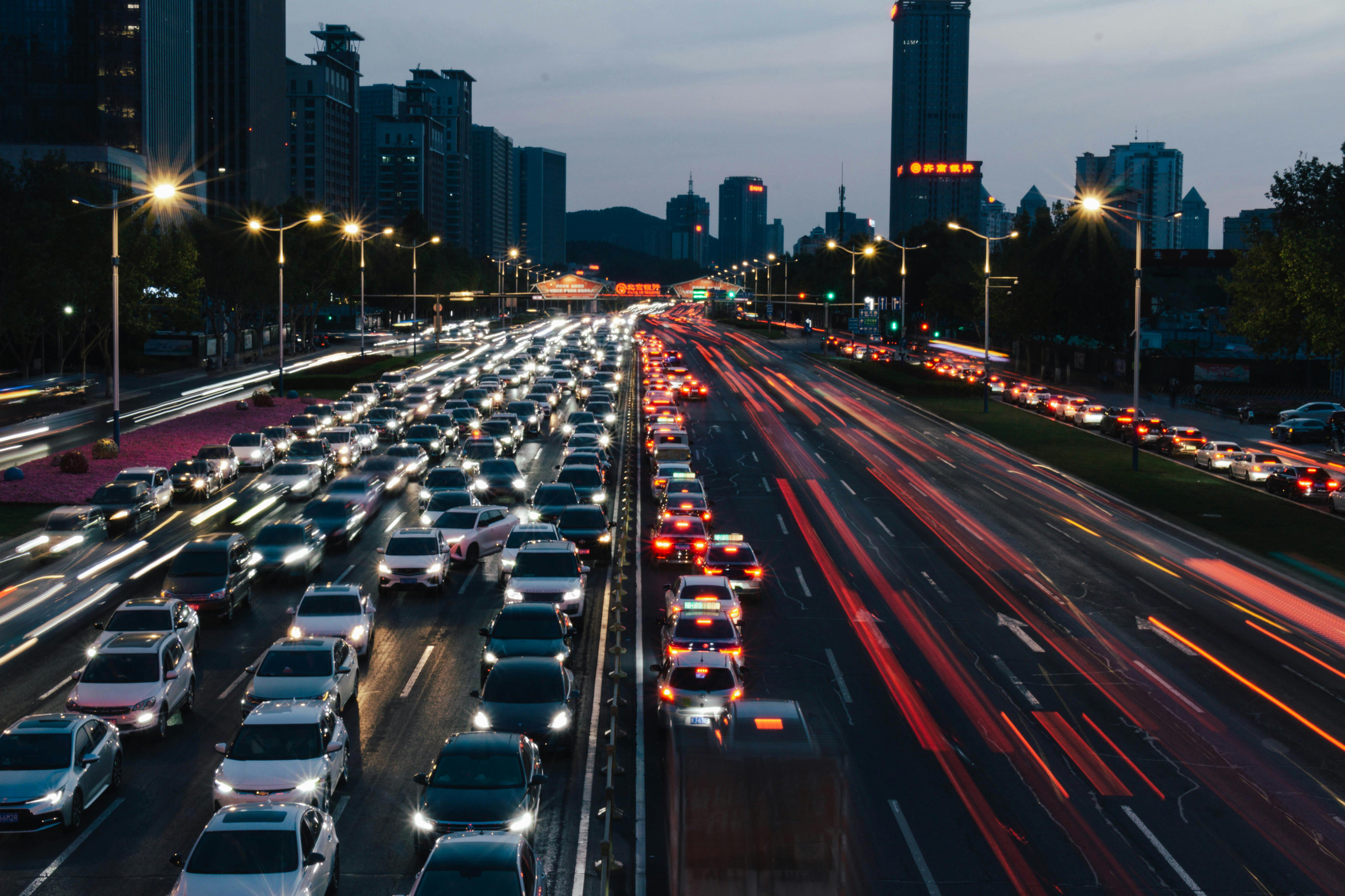 Rush Hour Traffic in the Downtown at Dusk · Free Stock Photo
