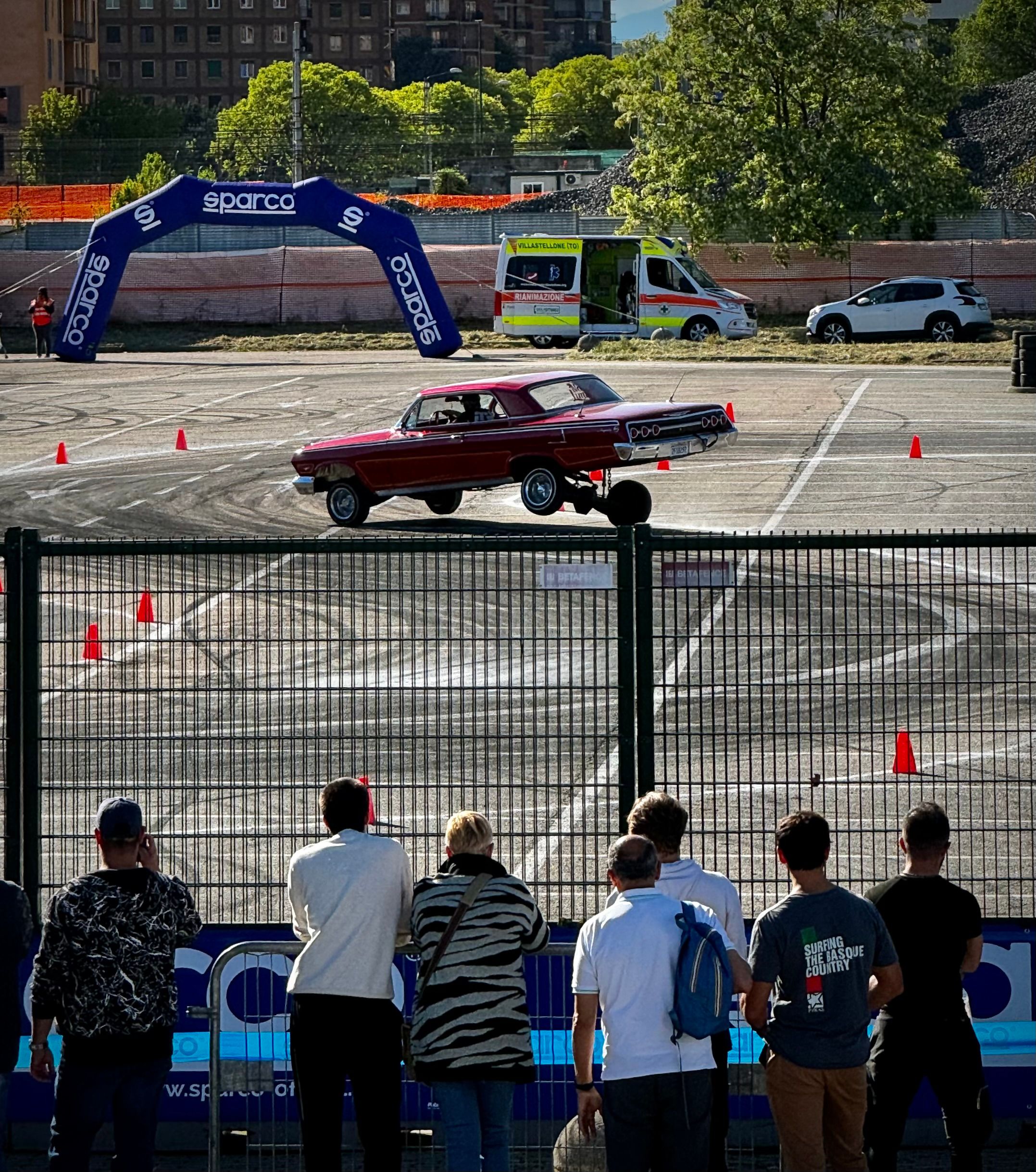 A car is doing a stunt in front of people · Free Stock Photo